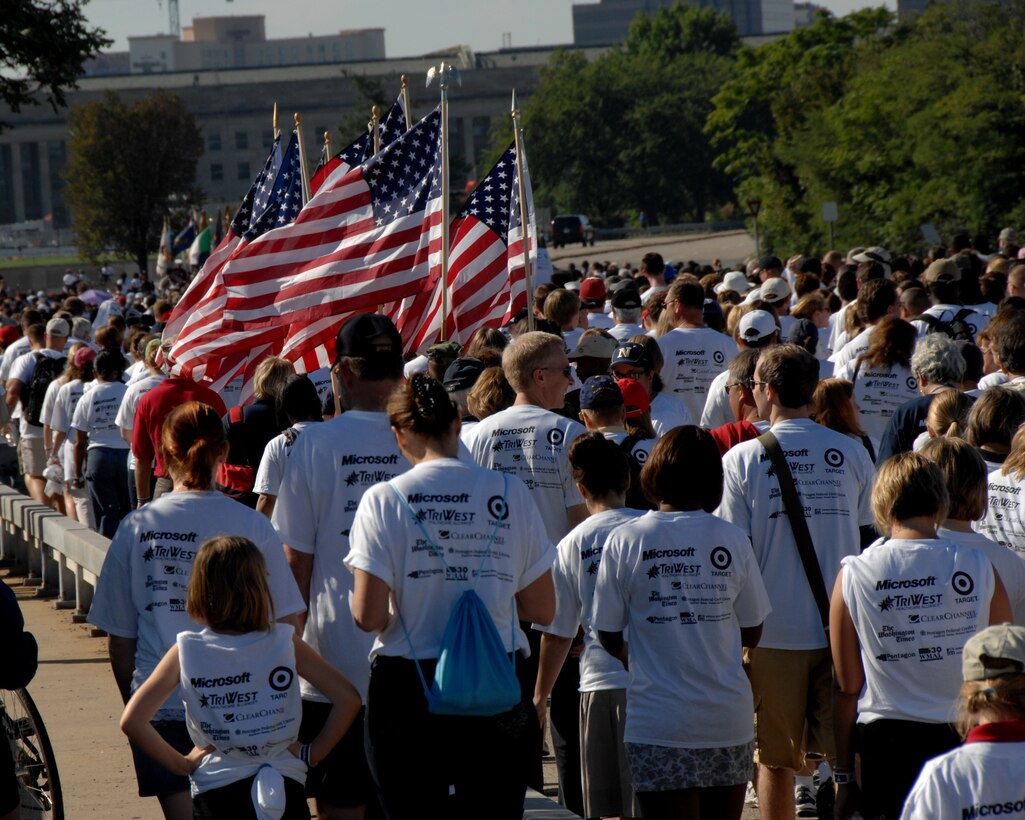 People walk toward the Pentagon during the America Supports You Freedom ...