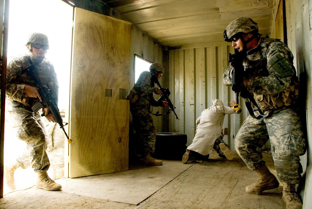 A mock Iraqi villager, portrayed by Army Staff Sgt. Brian Varn, is ...