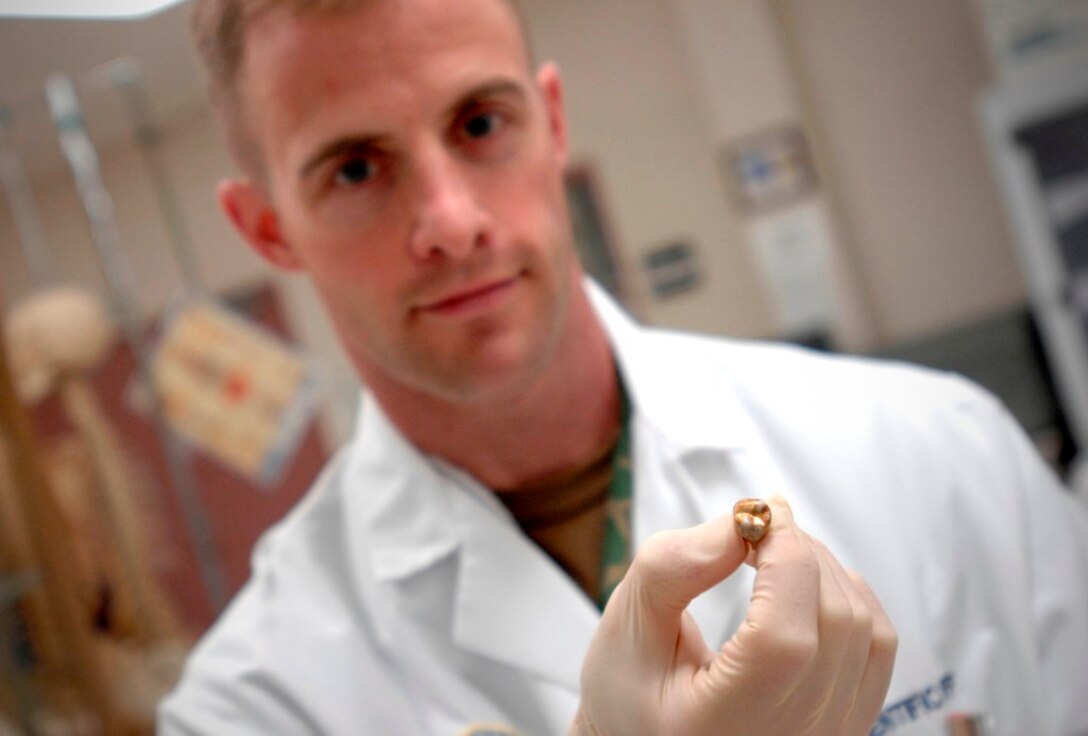 Navy Cdr. Kevin R. Torske, lead dentist at the Central Identification ...