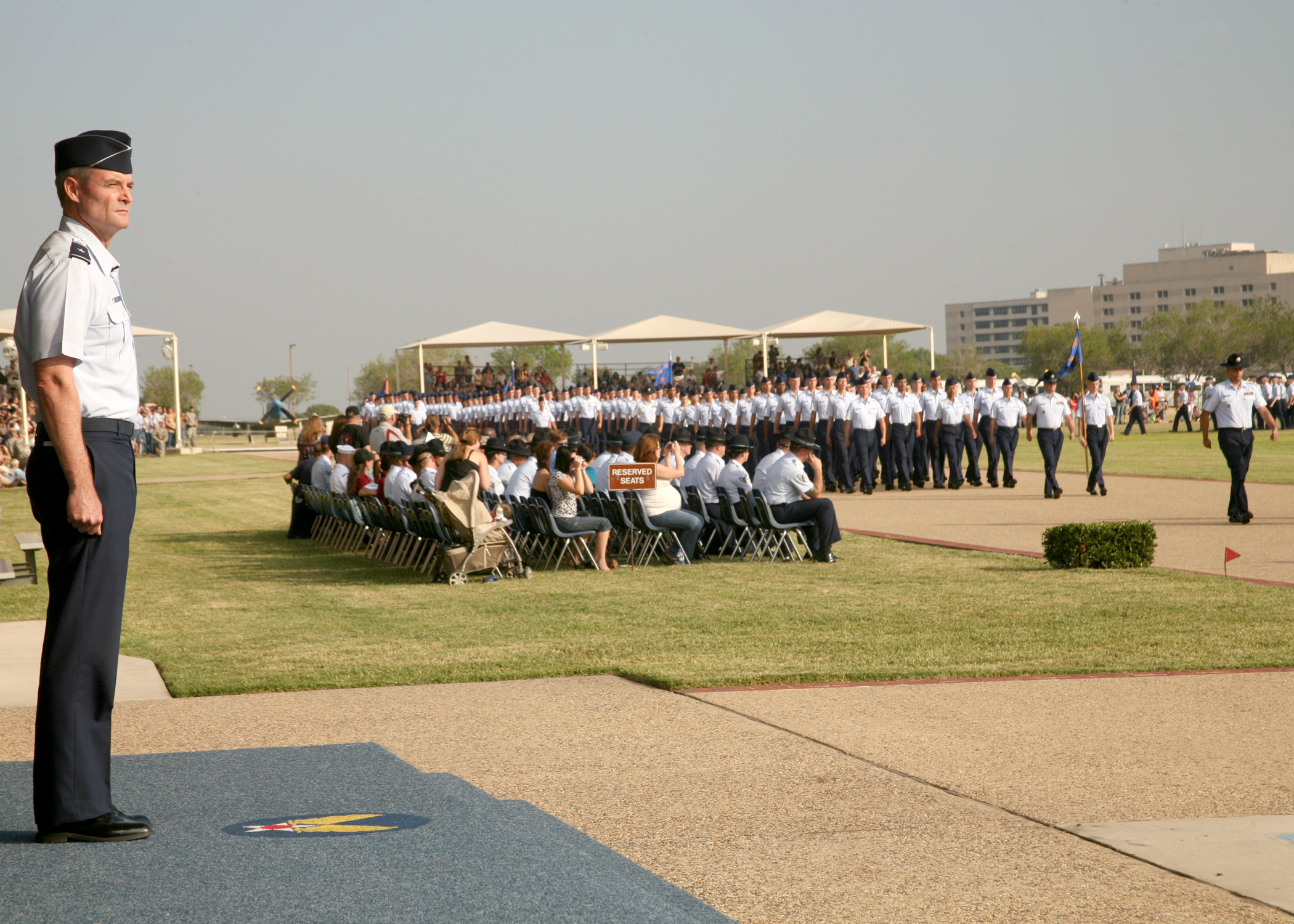 Commander reviews BMT graduates
