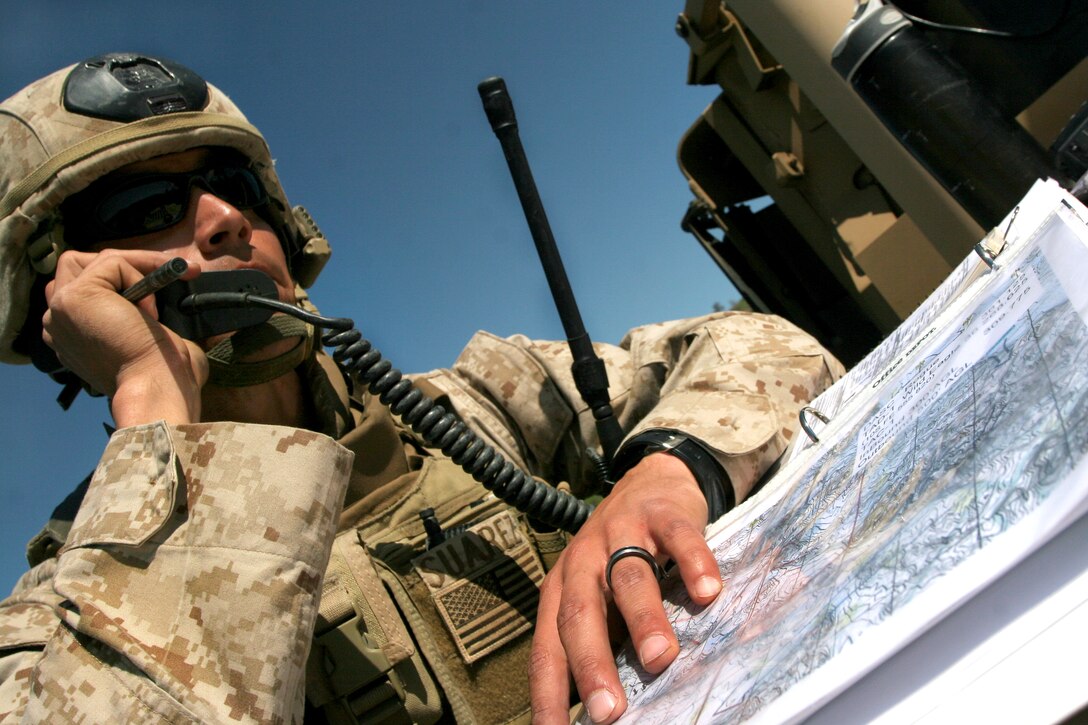 U.S. Marine Capt. Robert Suarez establishes communication with range ...