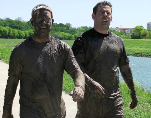 Dallas recruiters get muddy raising money for charity