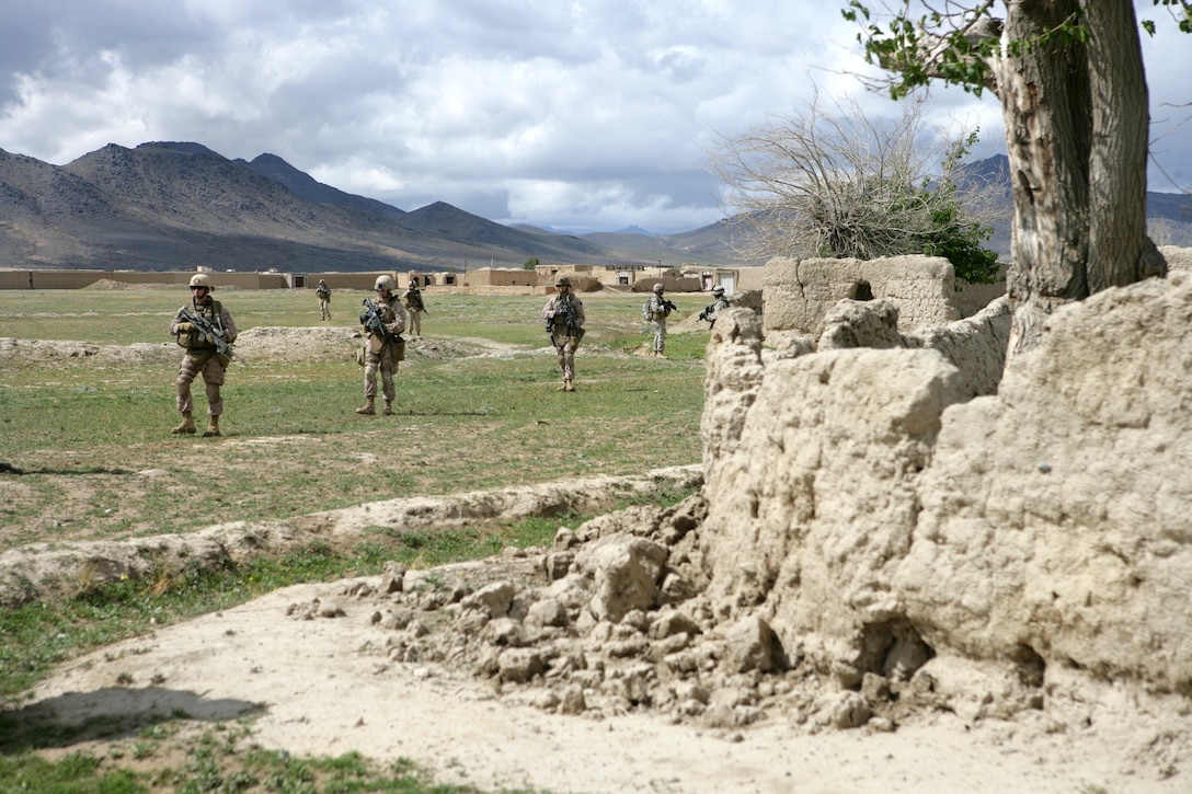U.S. Marines conduct a security patrol in the abandoned village of Now ...