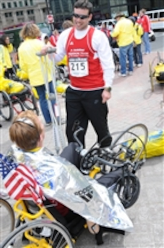 Staff Sgt. John Walding and Maj. Kent Solheim joke after both finishing ...