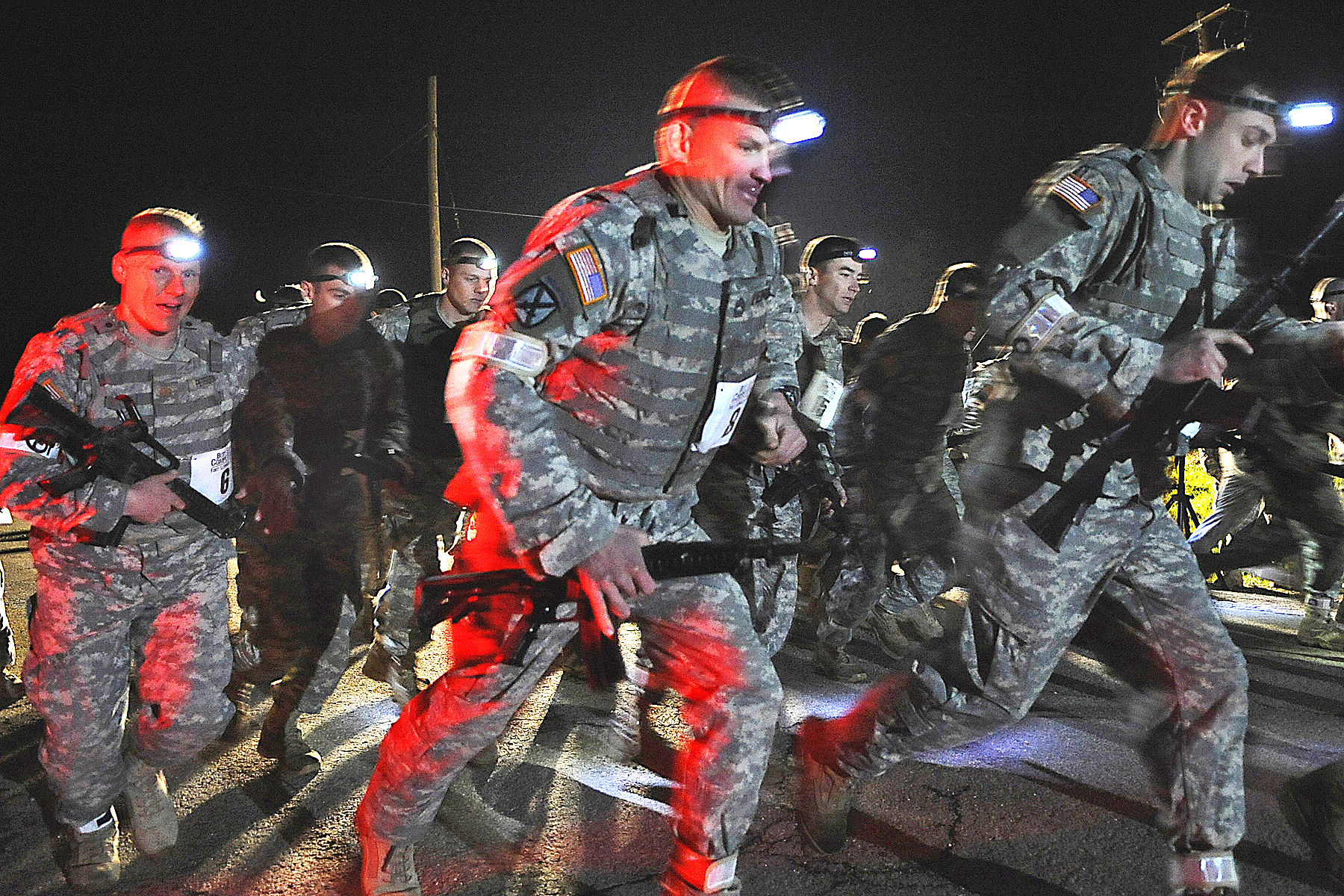 U.S. Army soldiers begin a three-mile buddy run while geared in Kevlar ...