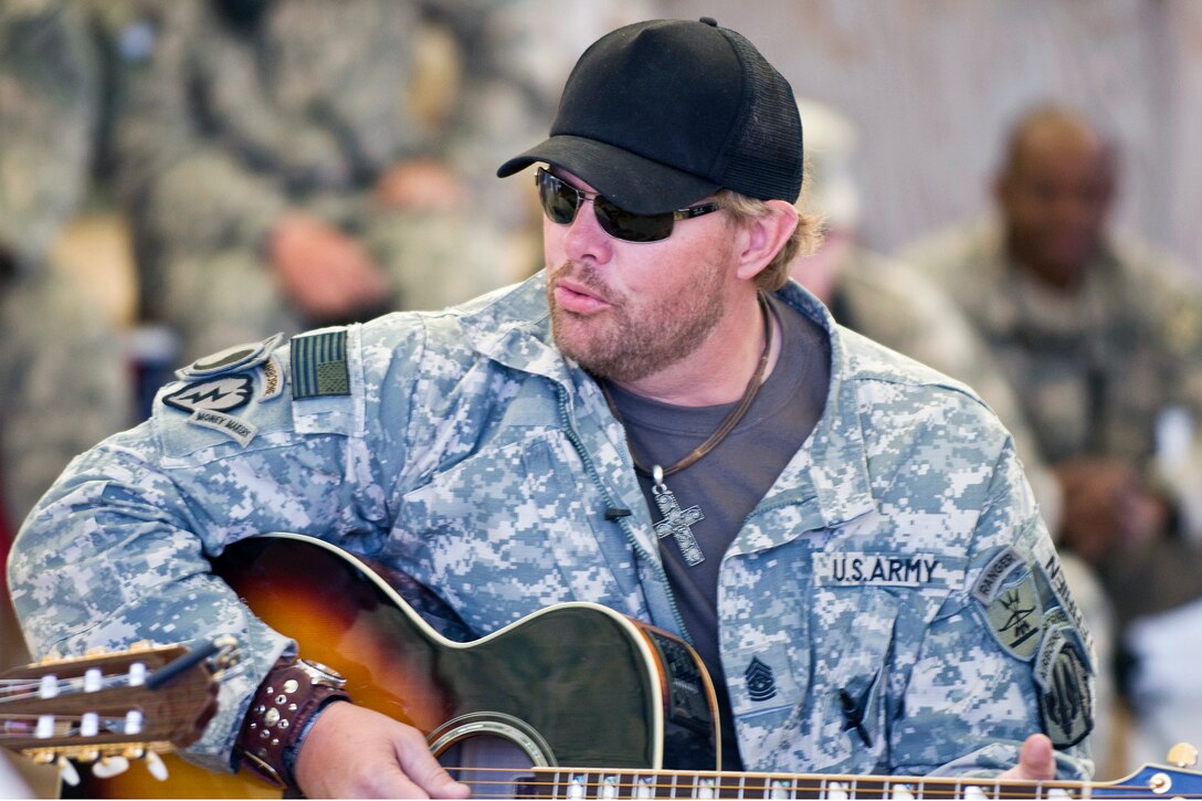 Toby Keith performs at Combat Outpost Boris in Afghanistan during his ...