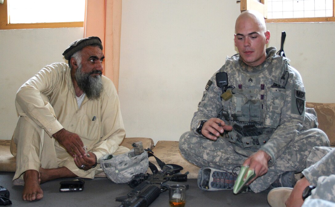 Army Sgt. Christopher C. Silva discusses training opportunities with ...