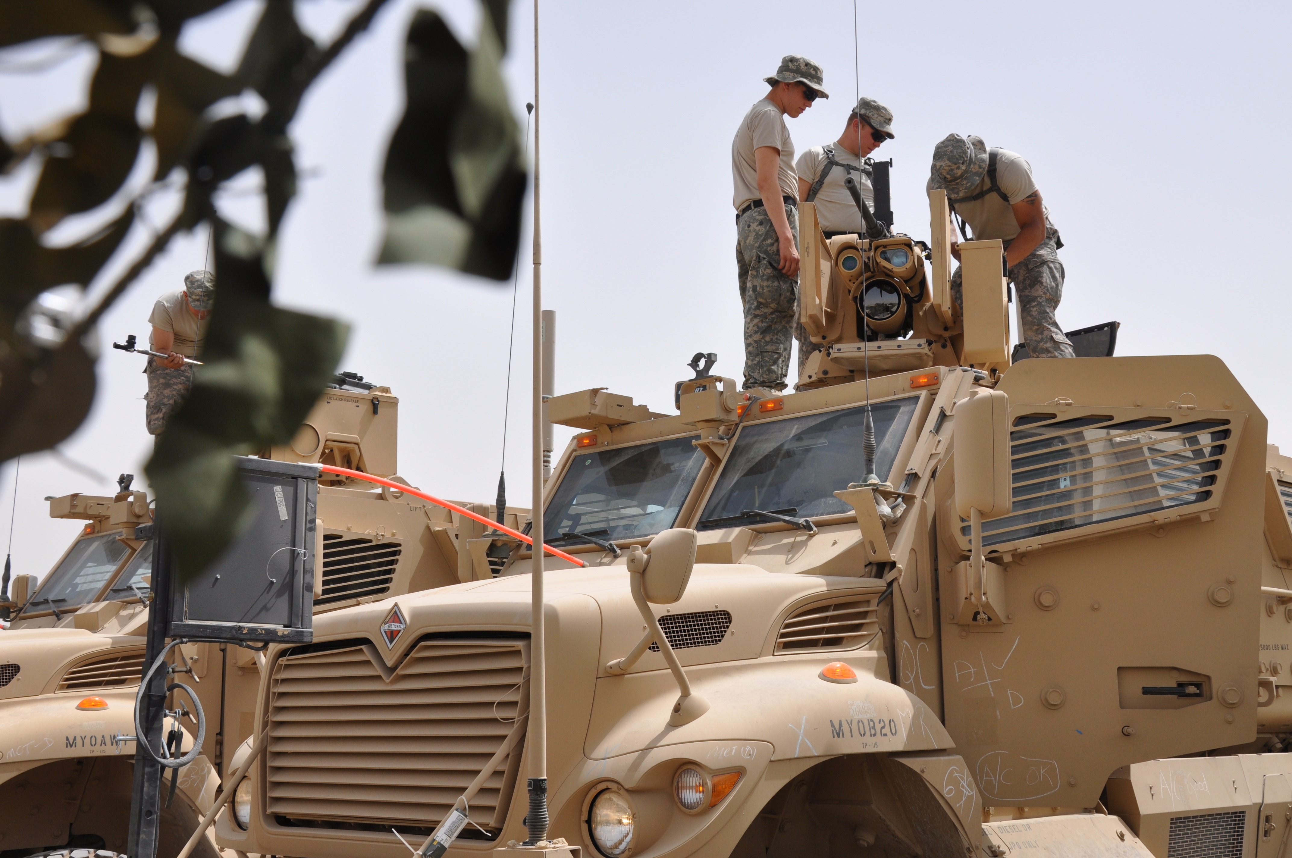 Soldiers of the 2nd Infantry Division’s 5th Brigade, Stryker Brigade Combat Team, equip their ...