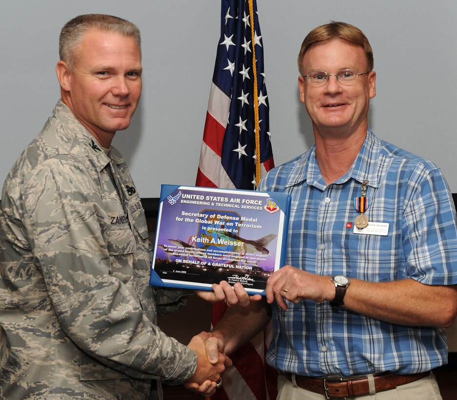 Civilian Awarded a Secretary of Defense Medal