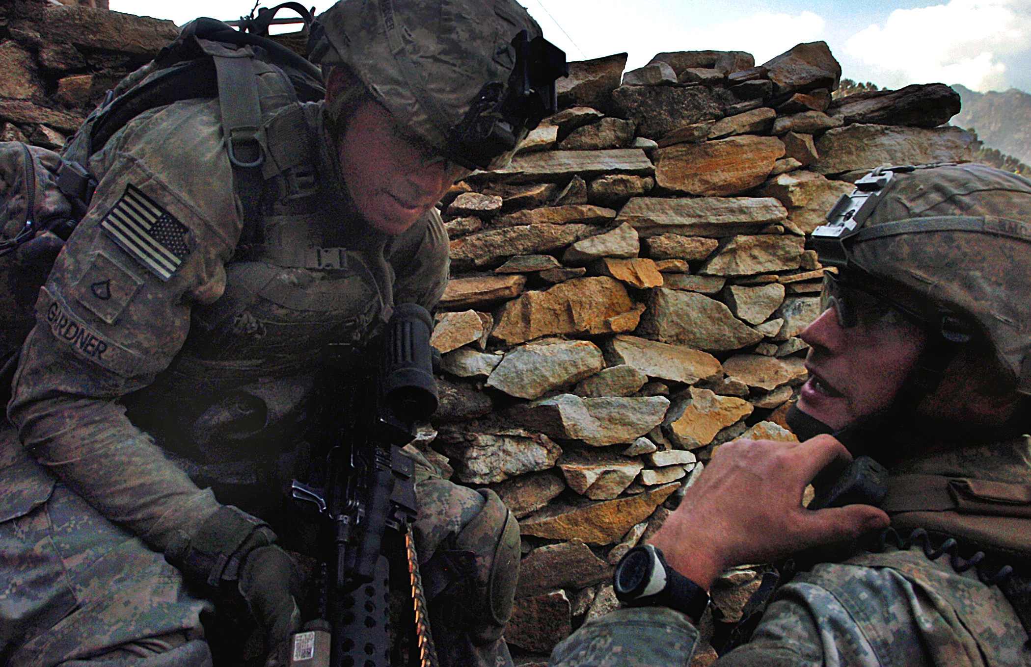 U.S. Army Sgt. Graham Mullins, left, gives an order to U.S. Army Pfc ...