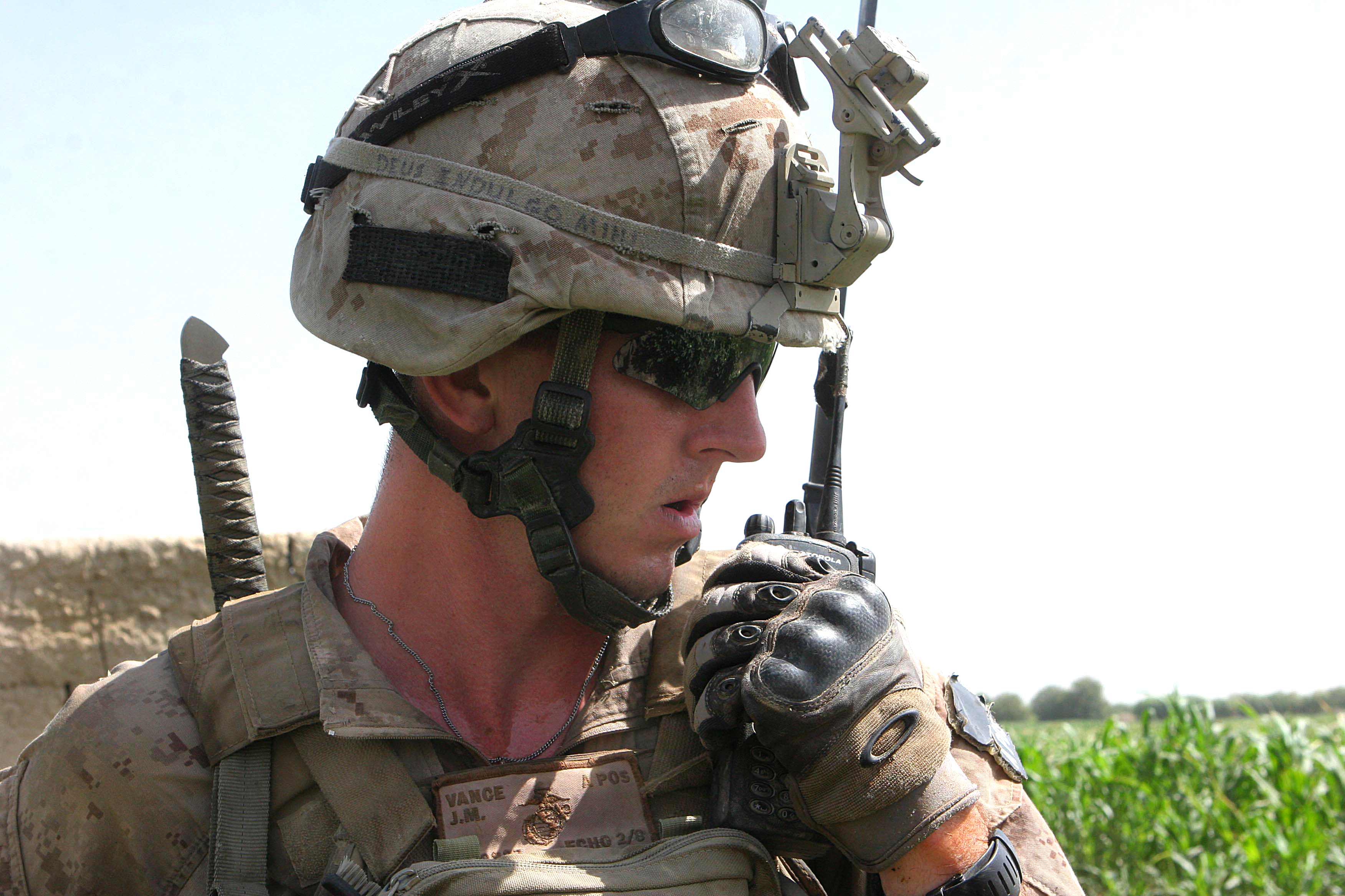 U.S. Marine Corps Lance Cpl. Josh Vance radios to his squad leader just ...