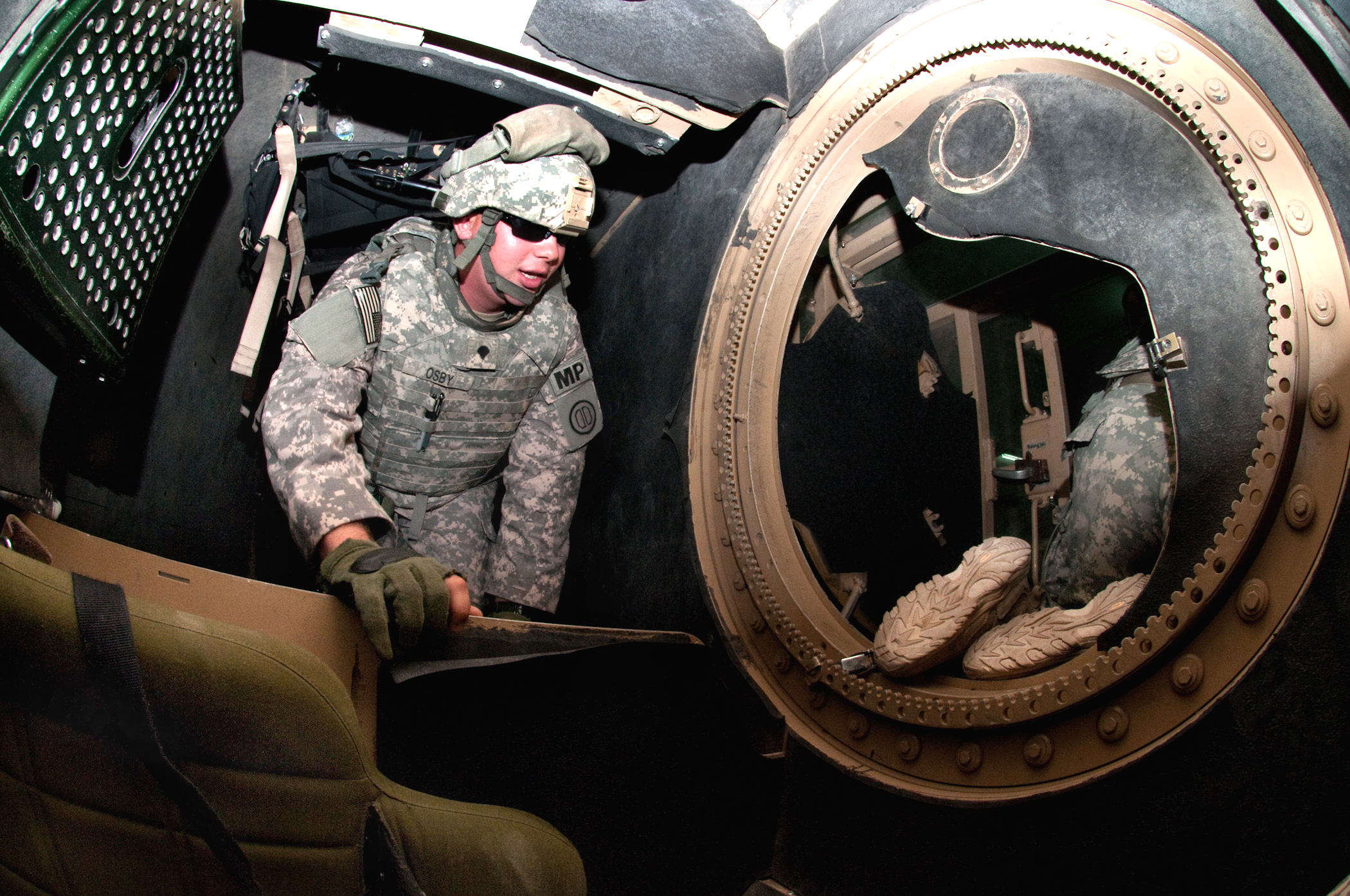 U.S. Army soldiers crawl from a Caiman mine-resistant, ambush-protected ...