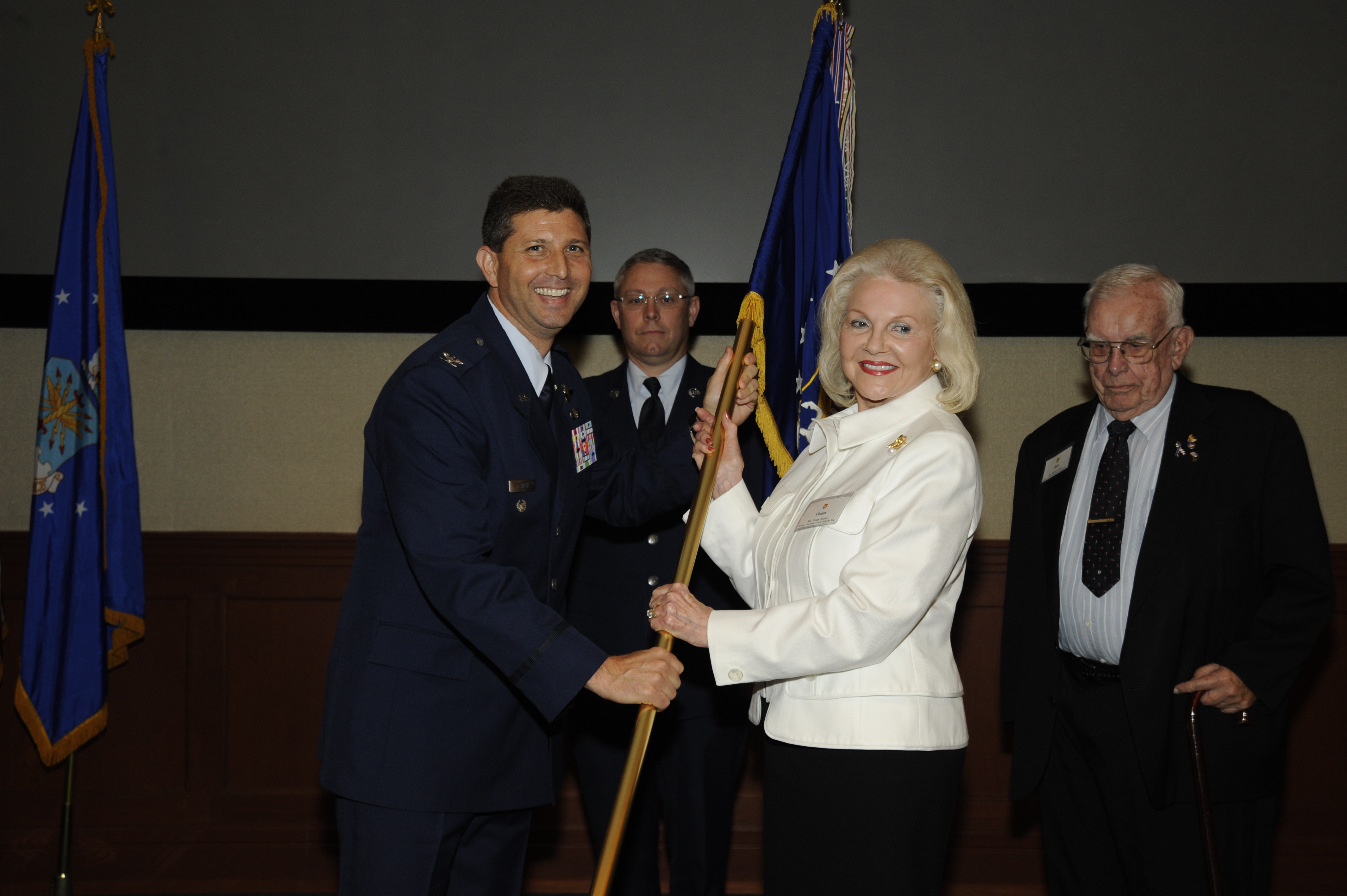 Mrs. Vivian Reeves receives the 927th Air Refueling Wing flag as the ...