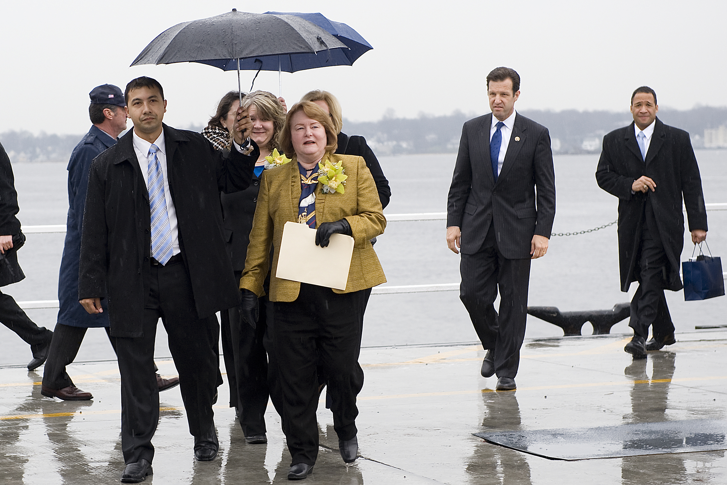 Becky Gates, wife of Defense Secretary Robert M. Gates is escorted to ...