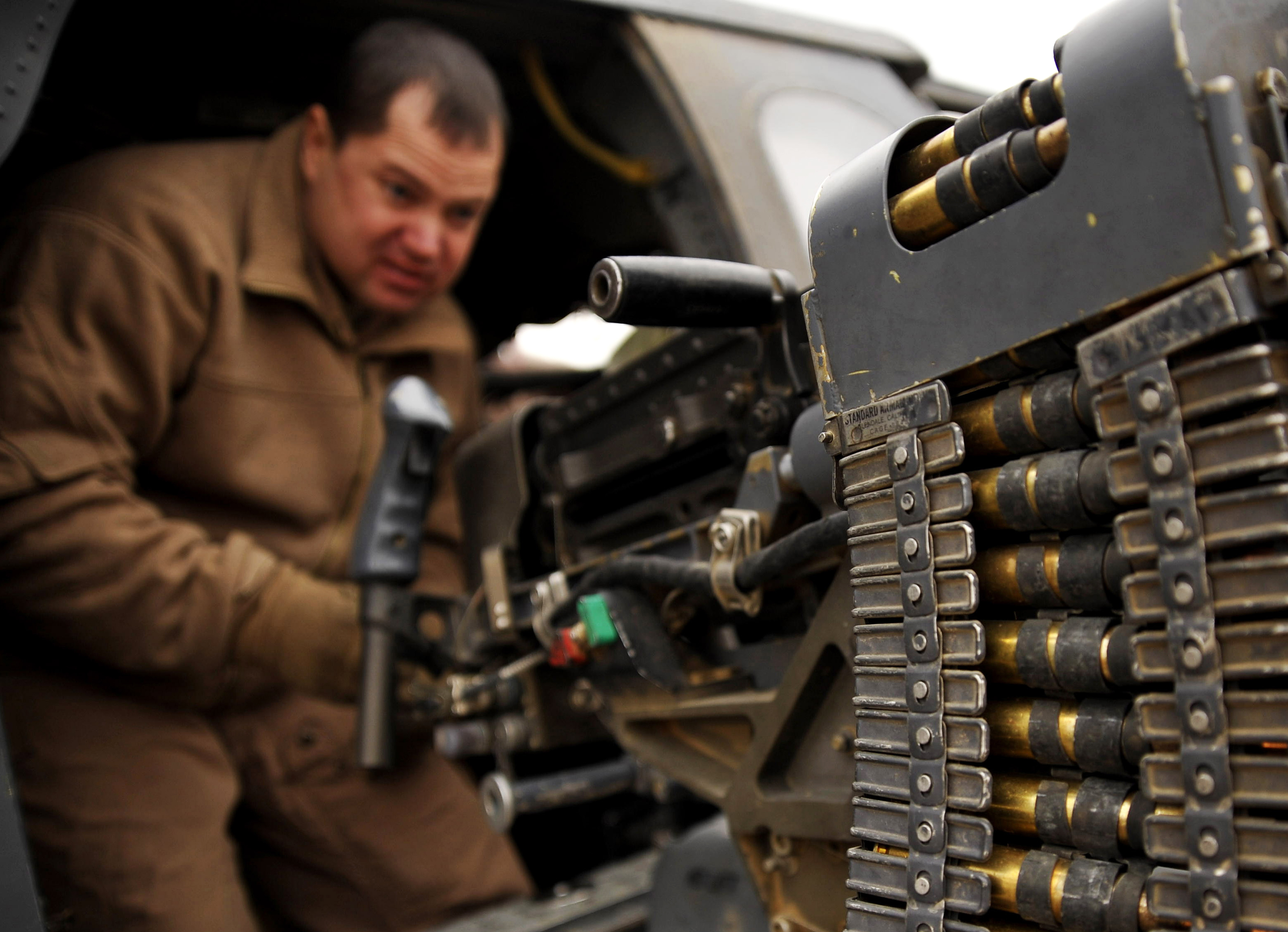 Master Sgt. Don Ballowe inspects his 50-caliber machine gun