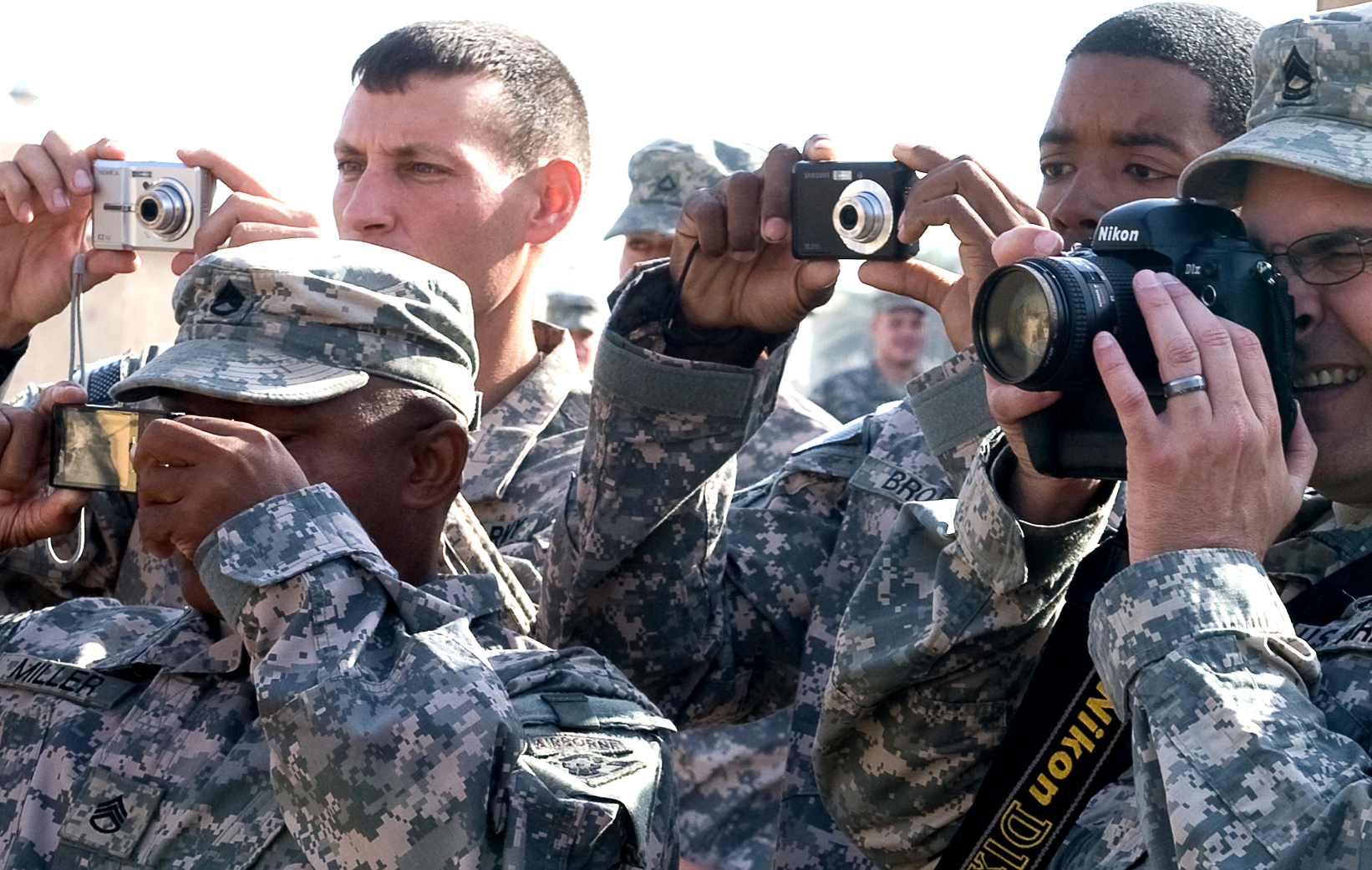 U.S. soldiers from the 194th Engineer Brigade take pictures of U.S ...