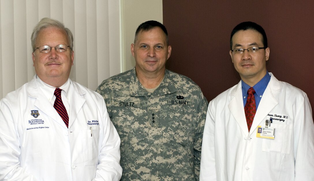 Maj. (Dr.) Jason Huang, right, an Army Reserve neurosurgeon who’s ...
