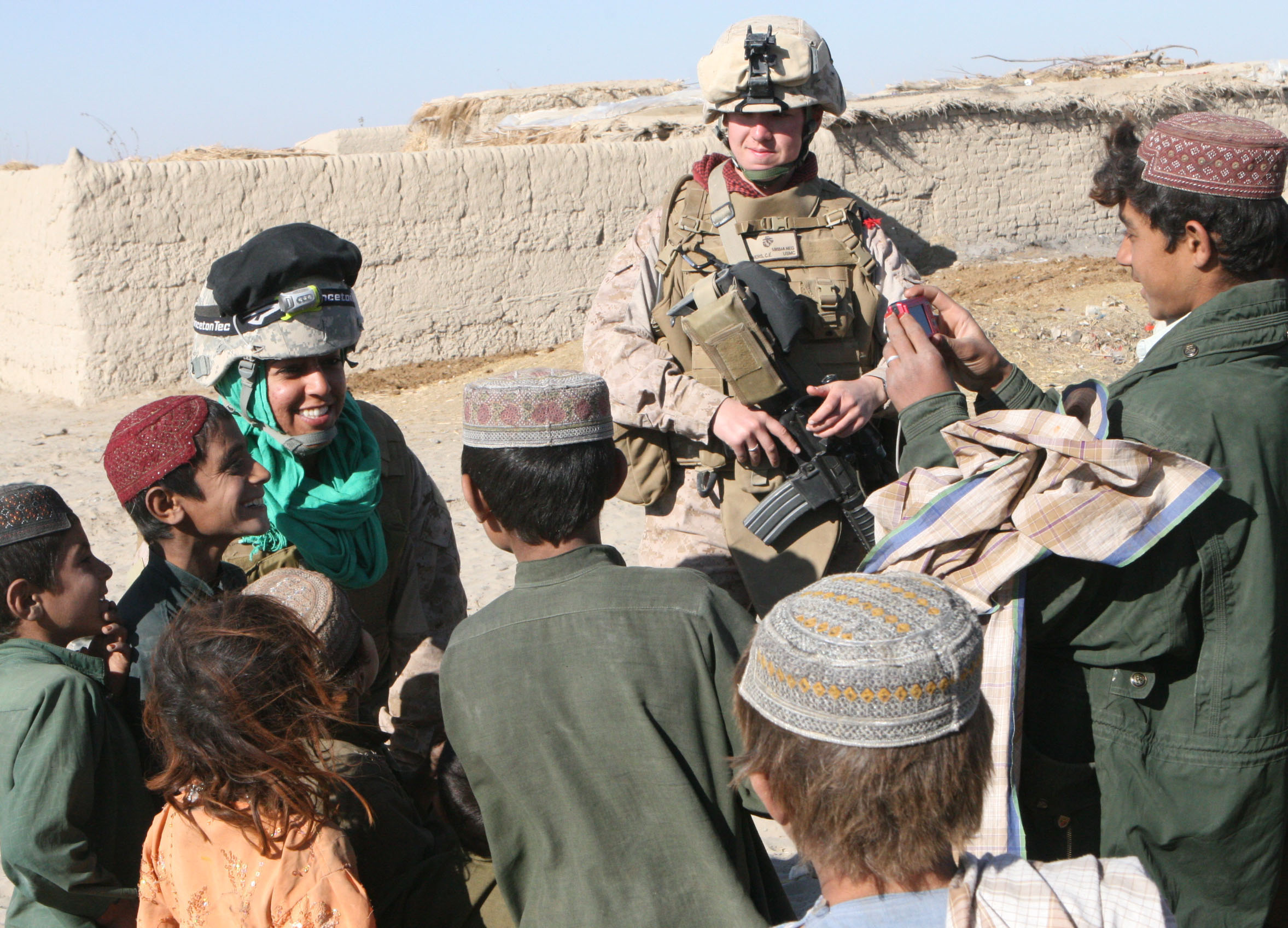 Marine Corps 2nd Lt. Carly E. Towers and Sahima Sheren, an interpreter ...