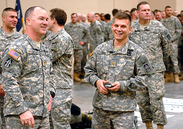 U.S. Army Maj. Wesley A. Russell and Maj. William Poag stand together ...