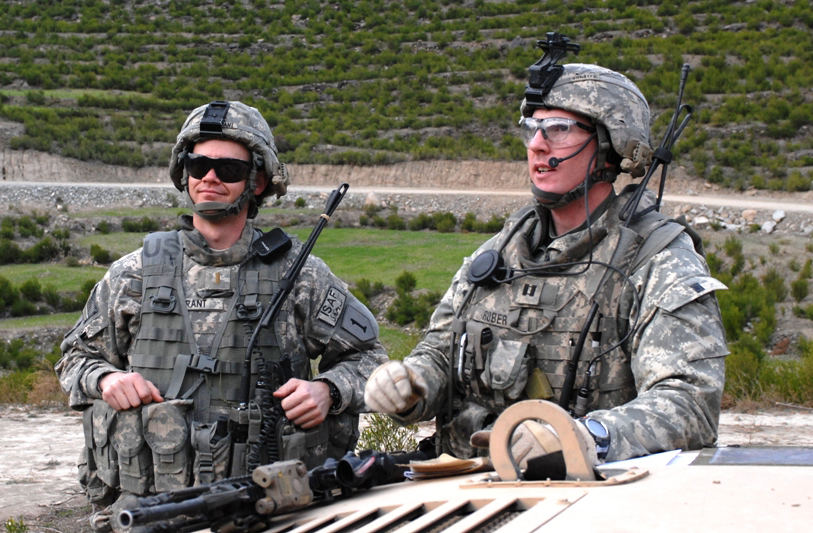 Army Capt. Paul Roberts gives a night-security plan to Army 1st Lt ...