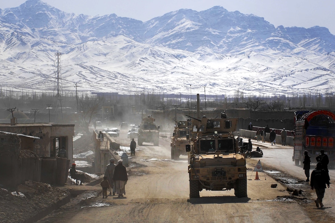 U.S. Army soldiers drive a convoy into Gardez City, Afghanistan, the ...