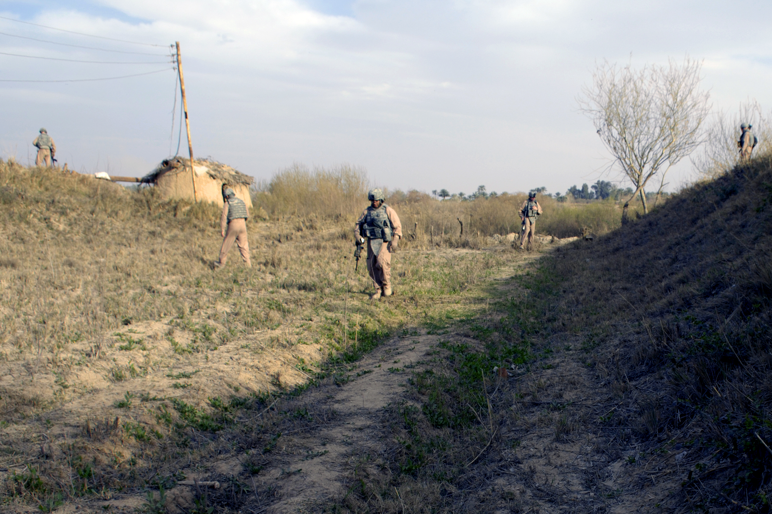 U.S. Army soldiers and airmen search for explosives on a farm in the ...