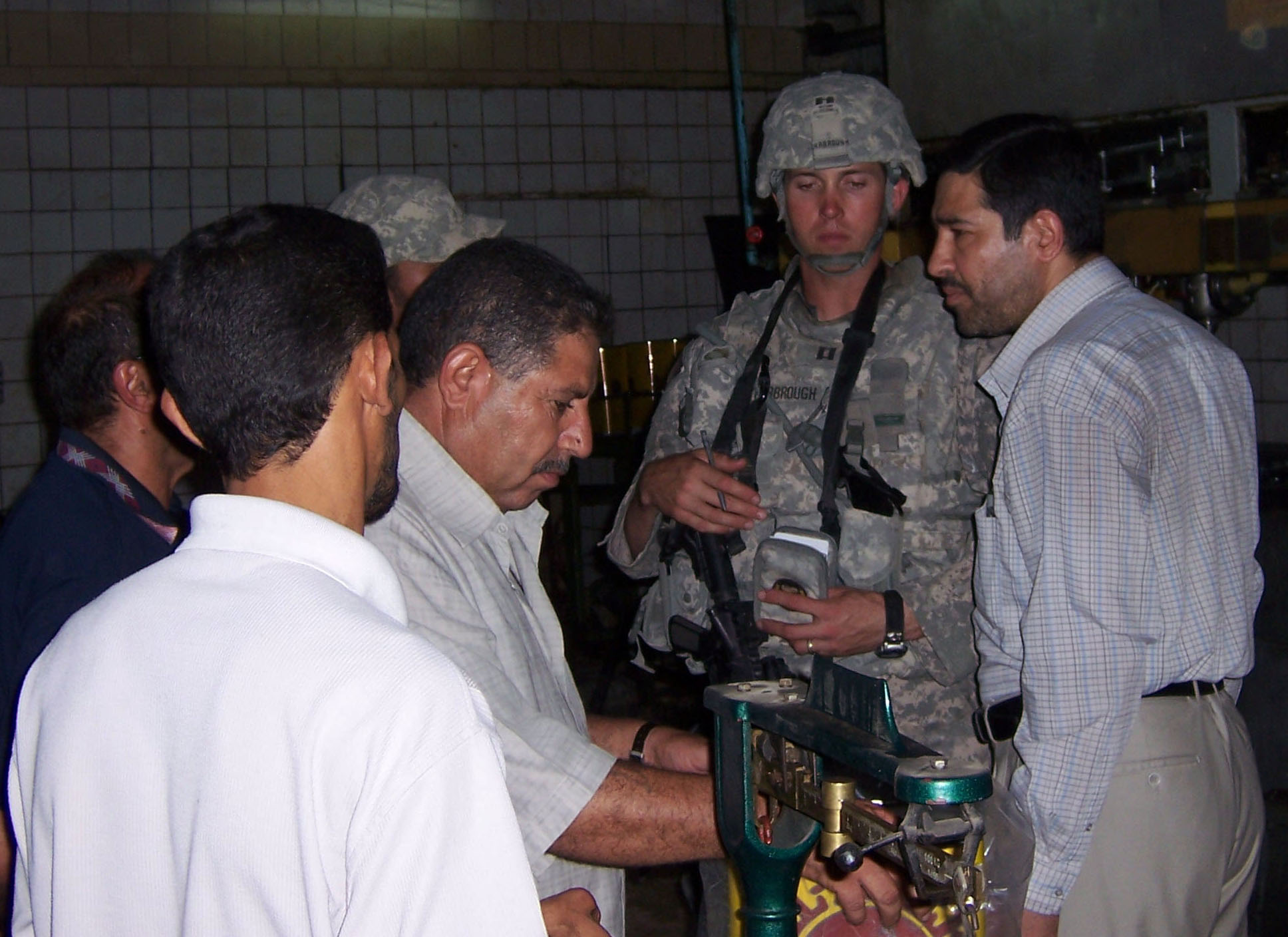 Army Capt. Eric Yarbrough assesses a soap and ghee factory in Amarah ...