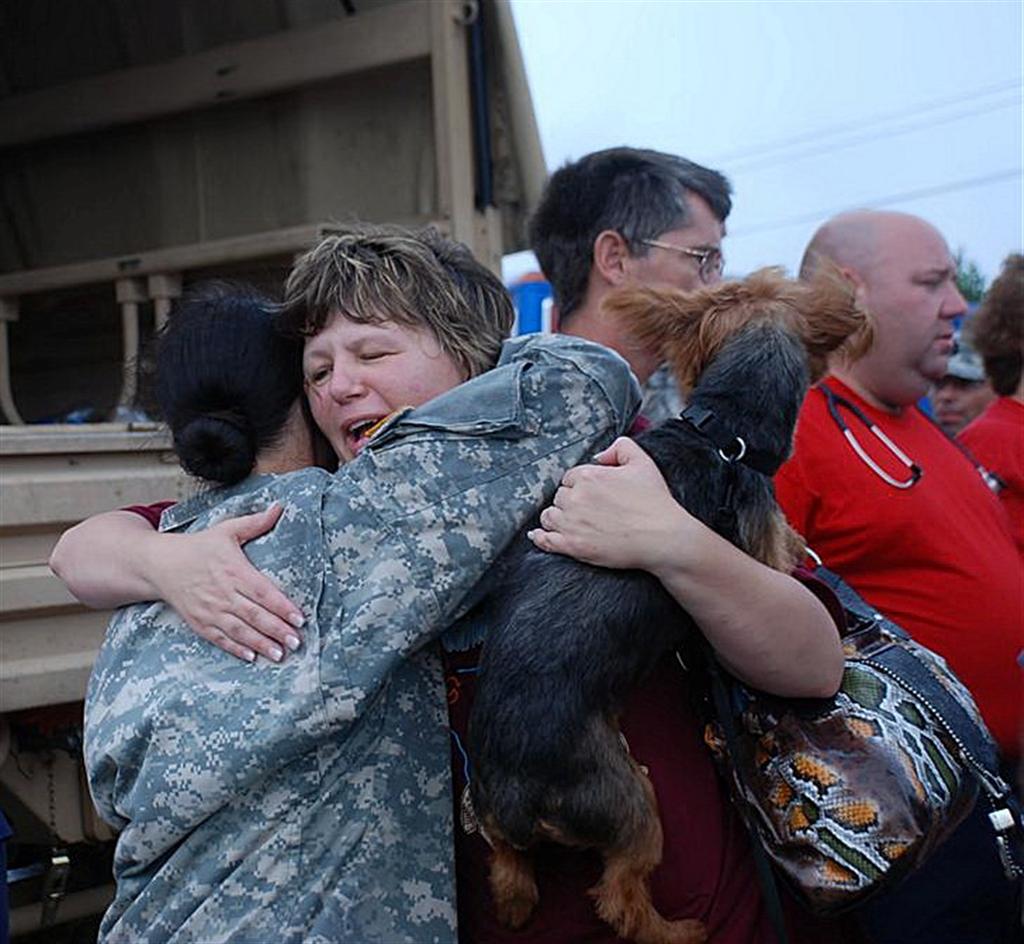 Army 2nd Lt. Angela K. Fry hugs her cousin Stephanie G. East, of ...