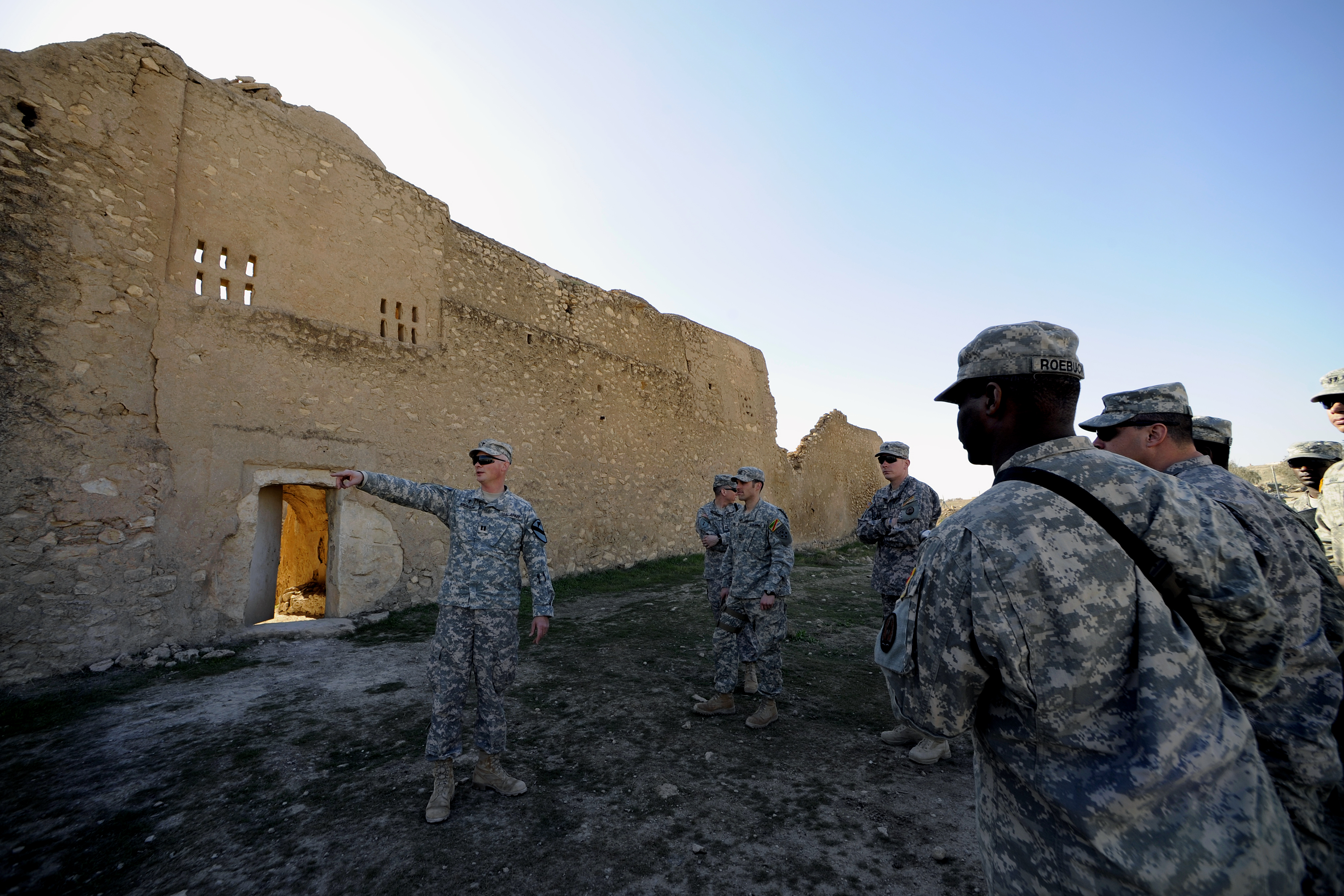 U.S. Army Capt. Rick Brunson, chaplain, left, gives soldiers a tour of ...