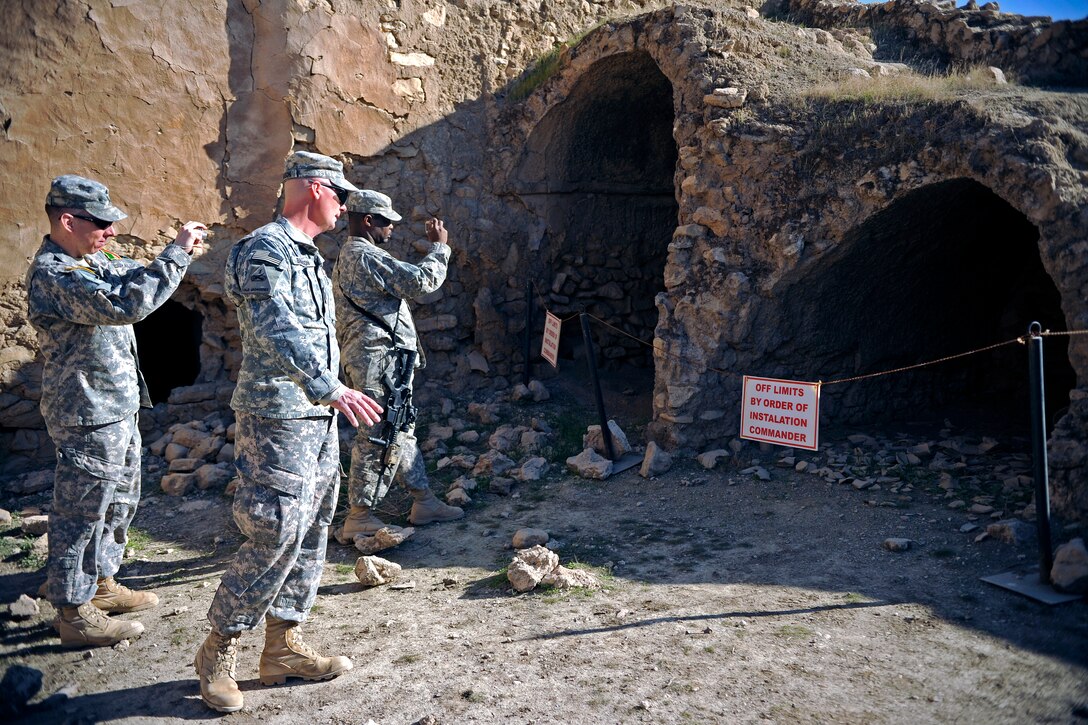 U.S. Army Capt. Rick Brunson, chaplain, right, gives a tour while Capt ...