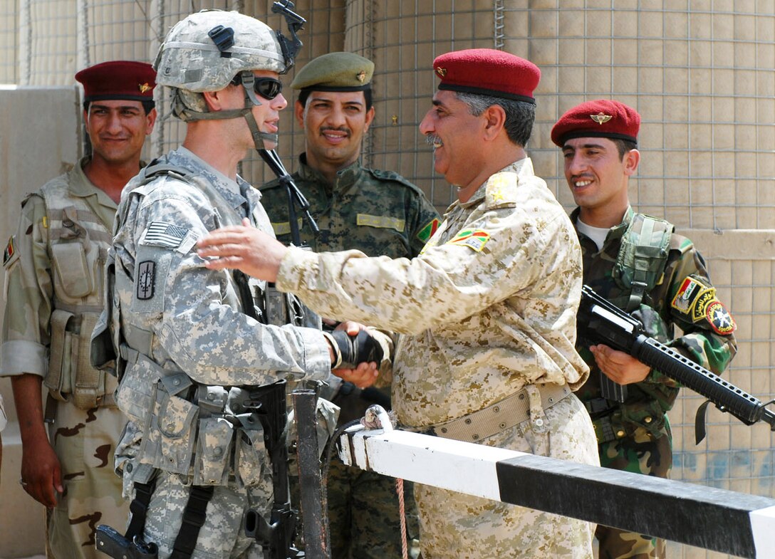 Army 1st Lt. Jeremy Poisson and Lt. Col. Mohamed Ali, executive officer ...