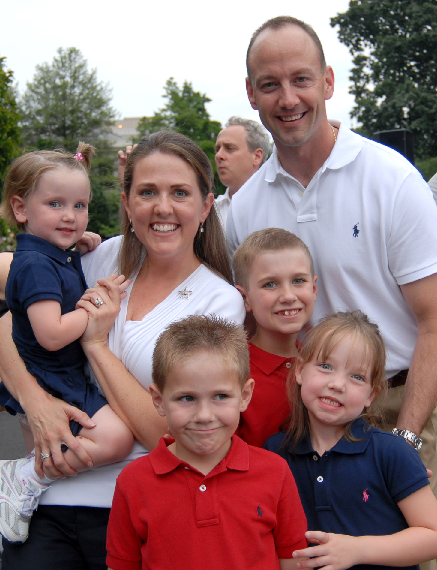 Air Force Capt. Ed Yonce, his wife Wendy and their four children pose ...