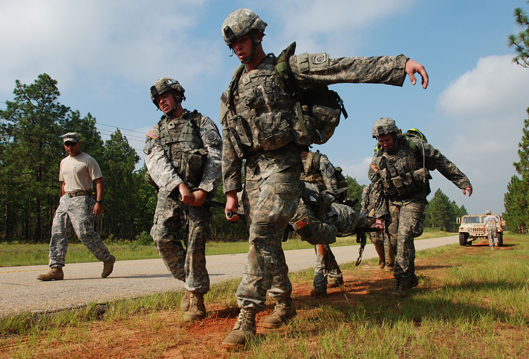 U.S. Army Spc. Stephen Segars, left, and Pfc. Colby Mooney help carry ...