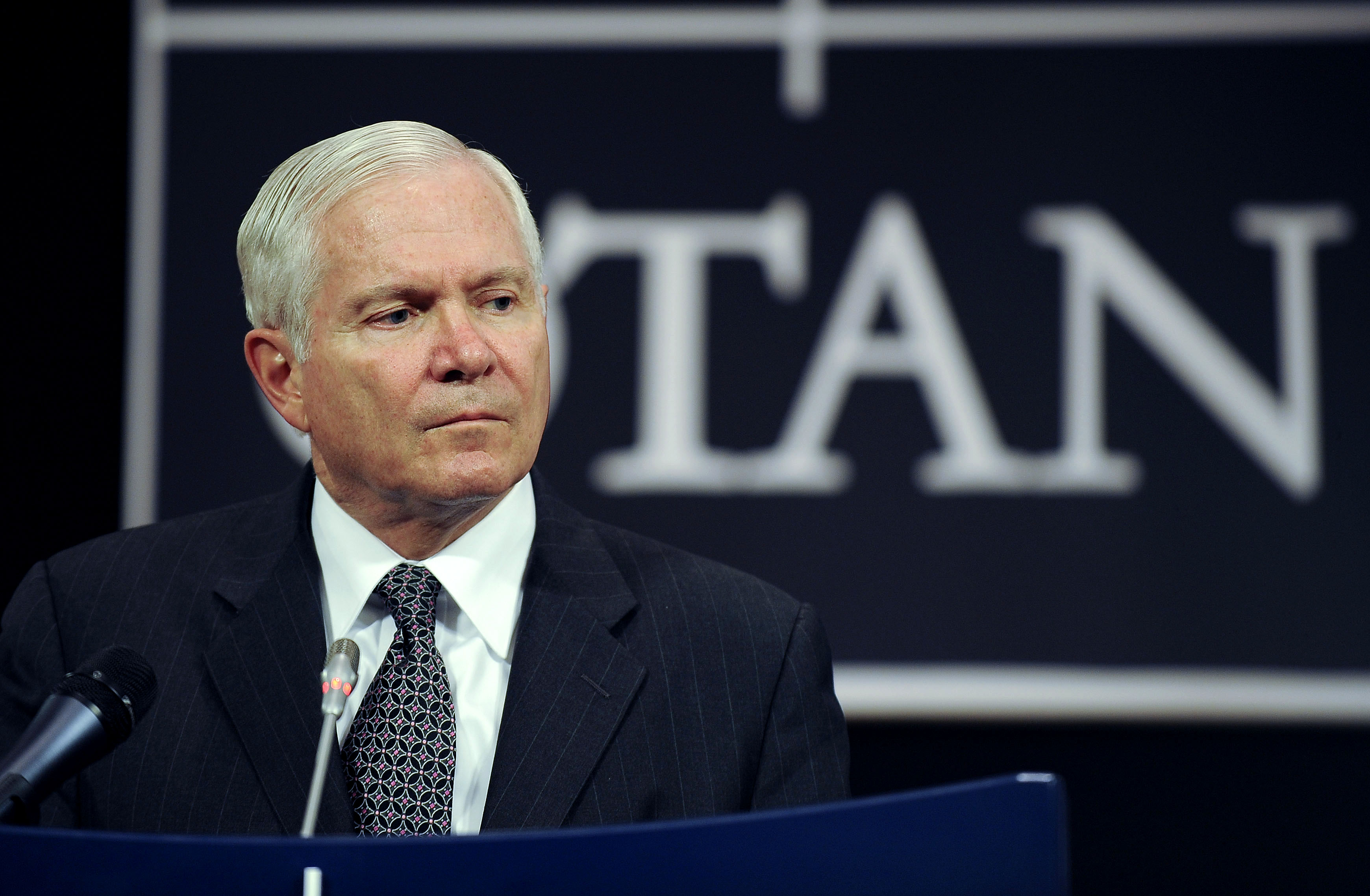 U.S. Defense Secretary Robert M. Gates listens to questions during a ...