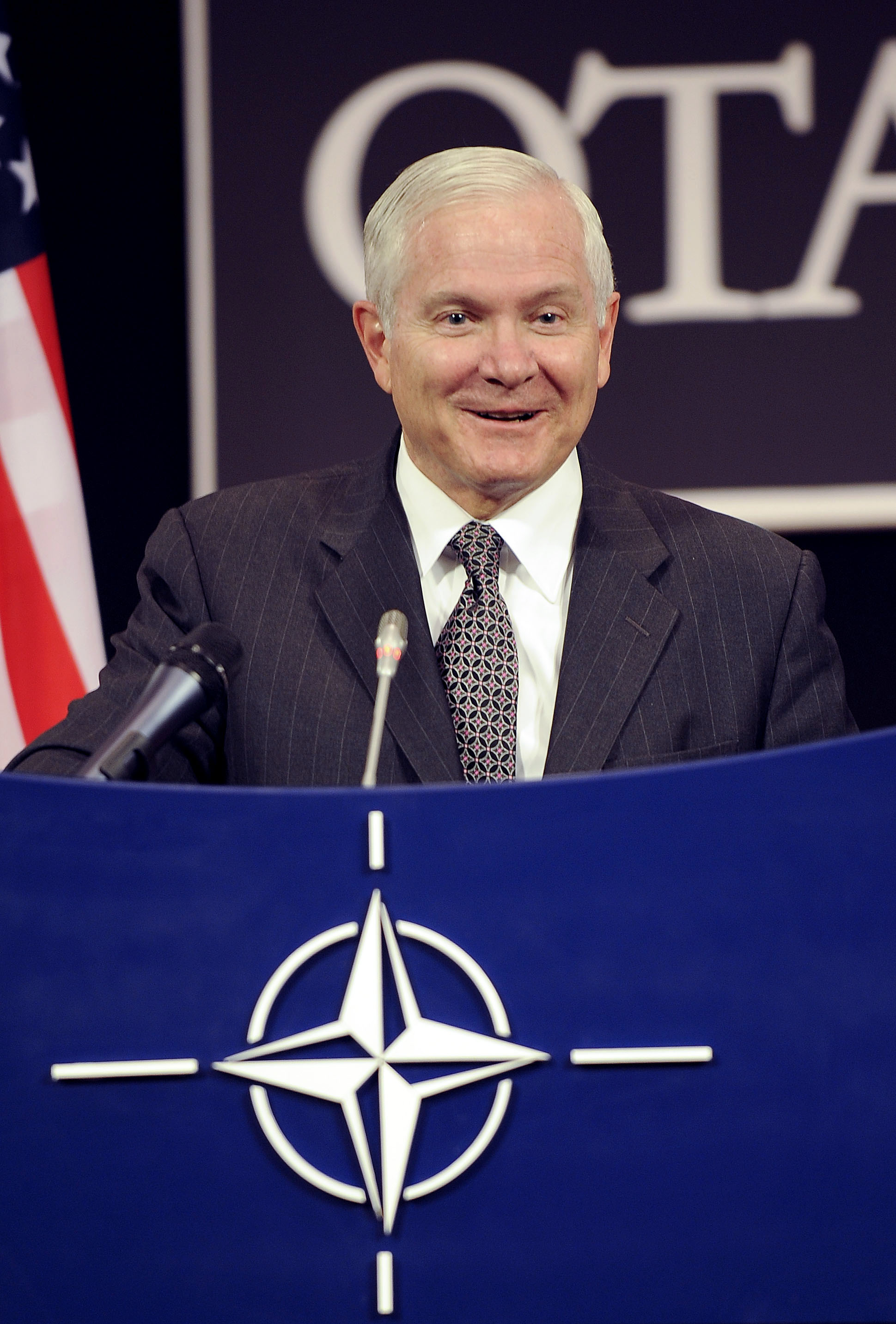 U.S. Defense Secretary Robert M. Gates reacts to questions during a ...