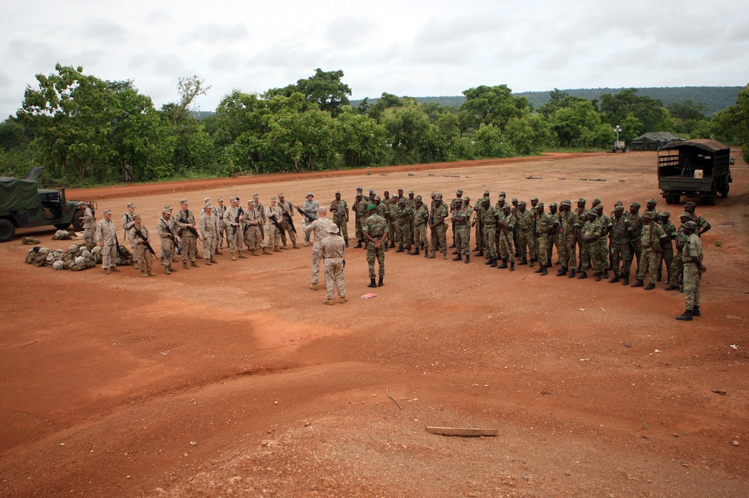 U.S. Marine Maj. John K. Jarrard briefs U.S. Marines and Beninese ...