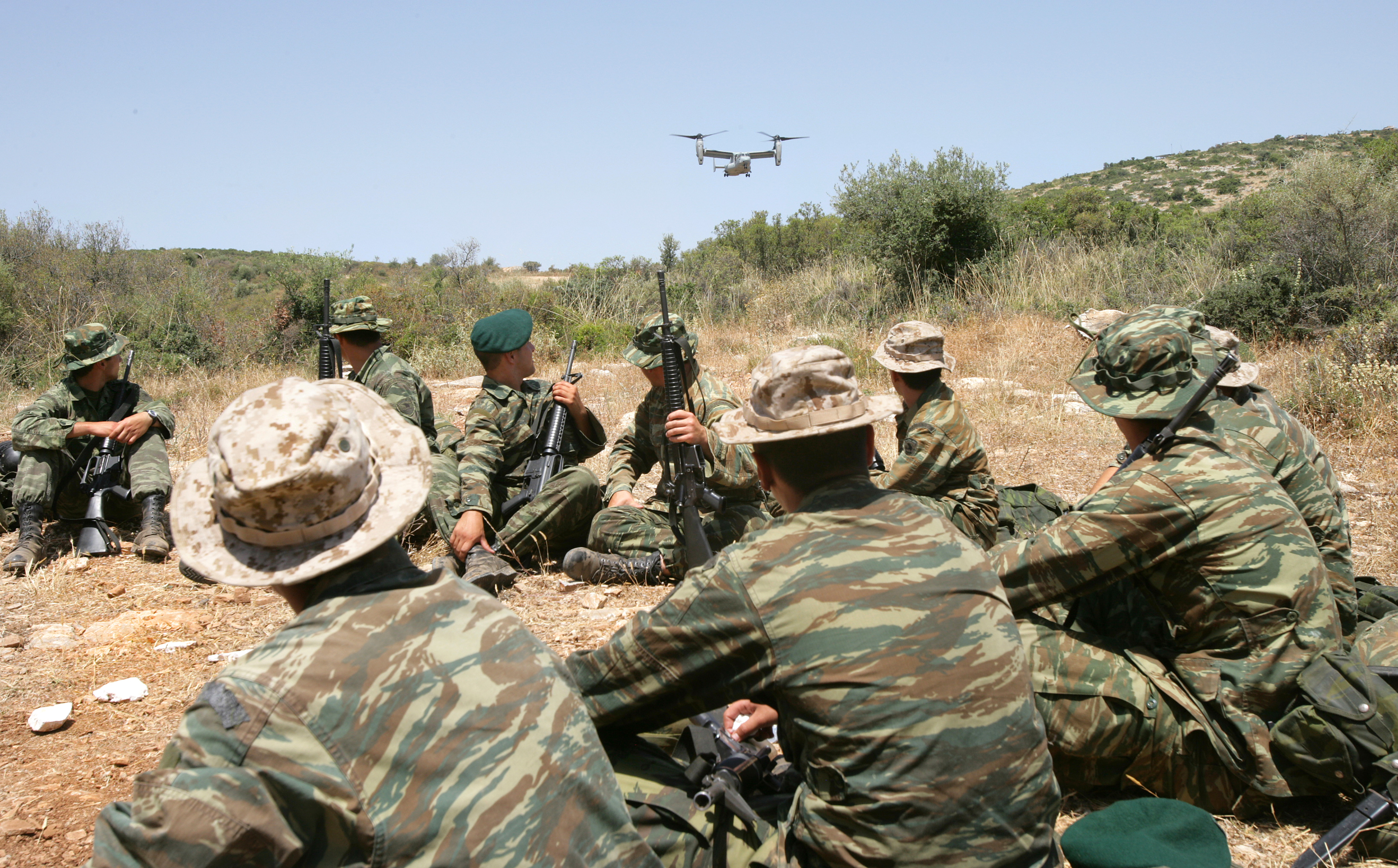 Greek Marines watch as an MV-22B Osprey assigned to Marine Medium ...