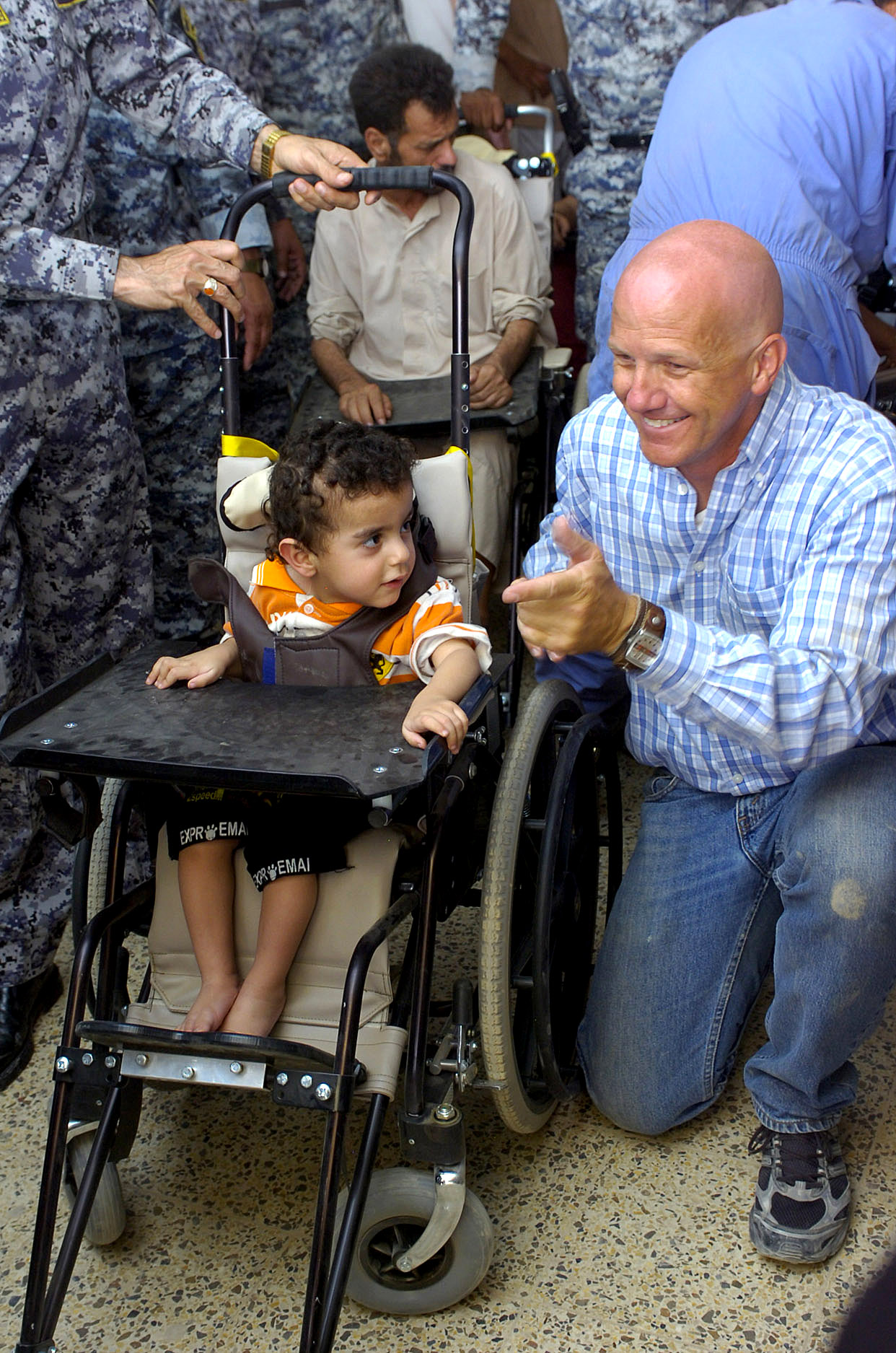 Brad Blauser, founder of Wheelchairs for Iraqi Kids, tries to make an ...
