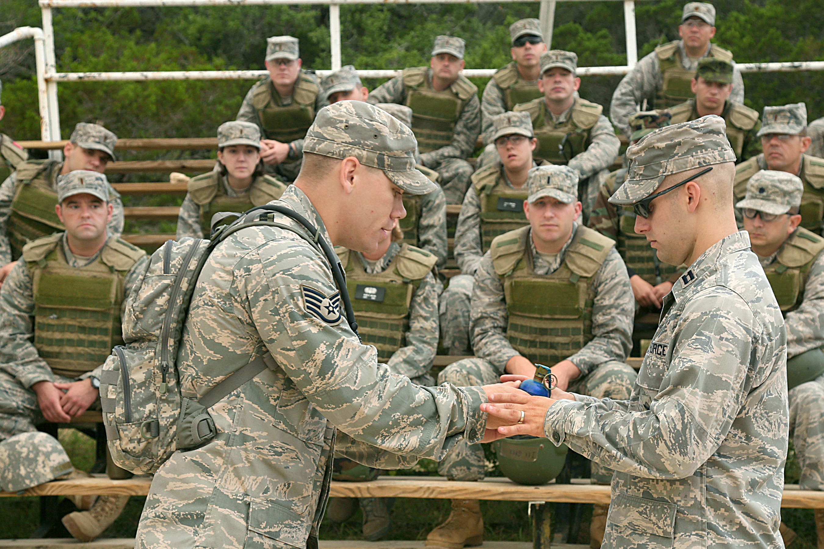 U.S. Air Force Staff Sgt. John Plemons, left, and Capt. Ryan Natalini ...