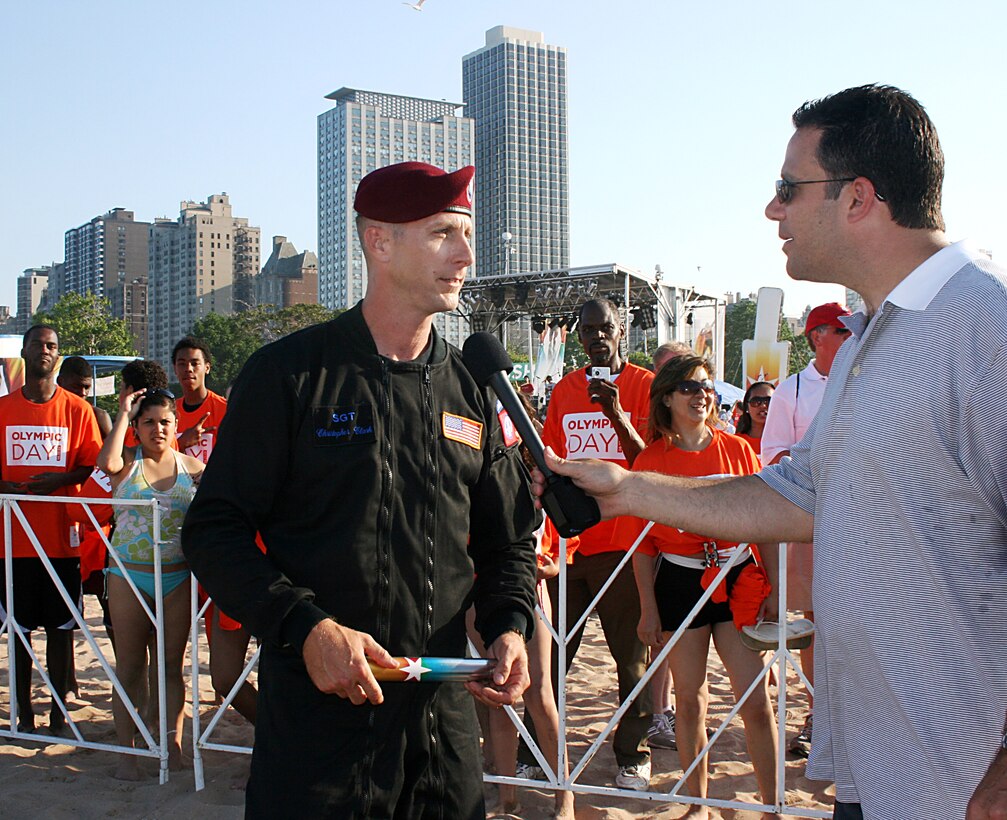 U.S. Army Sgt. Chris Clark is interviewed after executing a freefall in ...