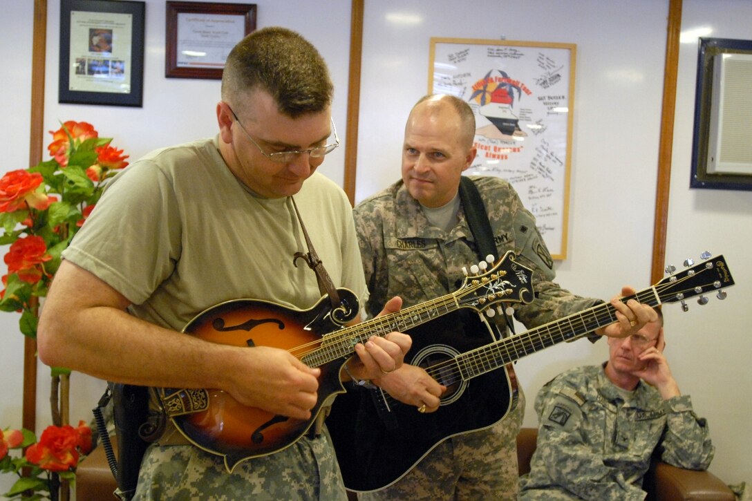 Army Lt. Col. Gregory Rawlings plays the lead mandolin as Army Chaplain ...