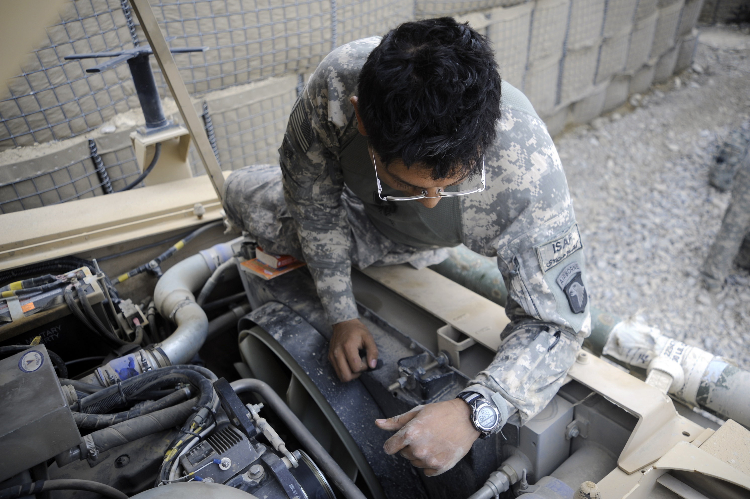 Vehicle maintainers travel rough road