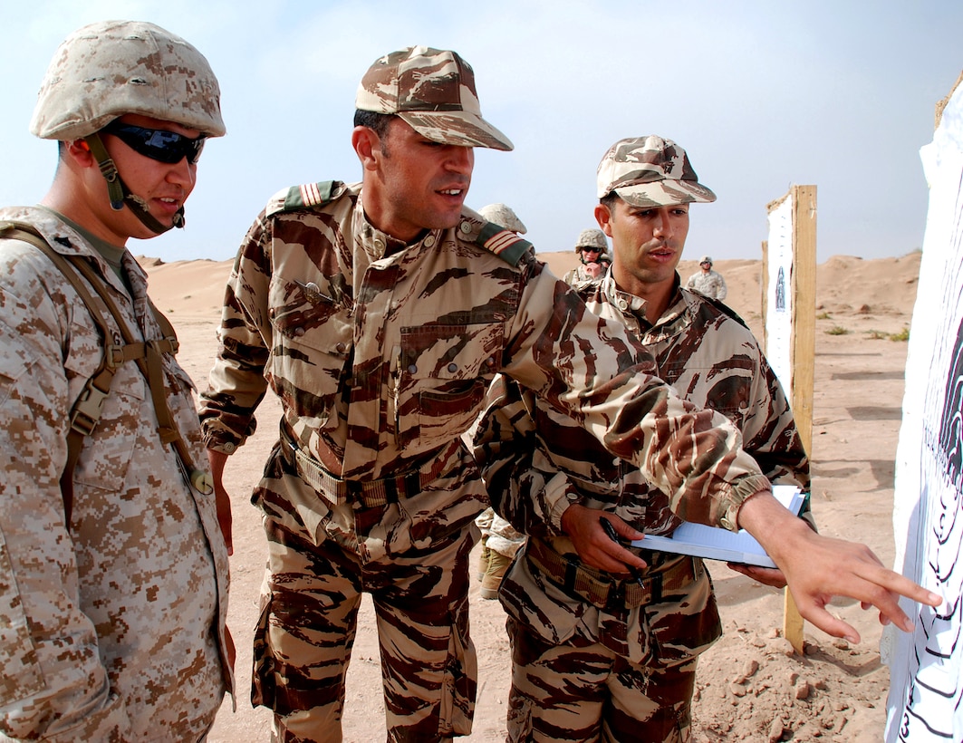 U.S. Marine Corps Cpl. Tou Vang, left, and two Moroccan soldiers ...