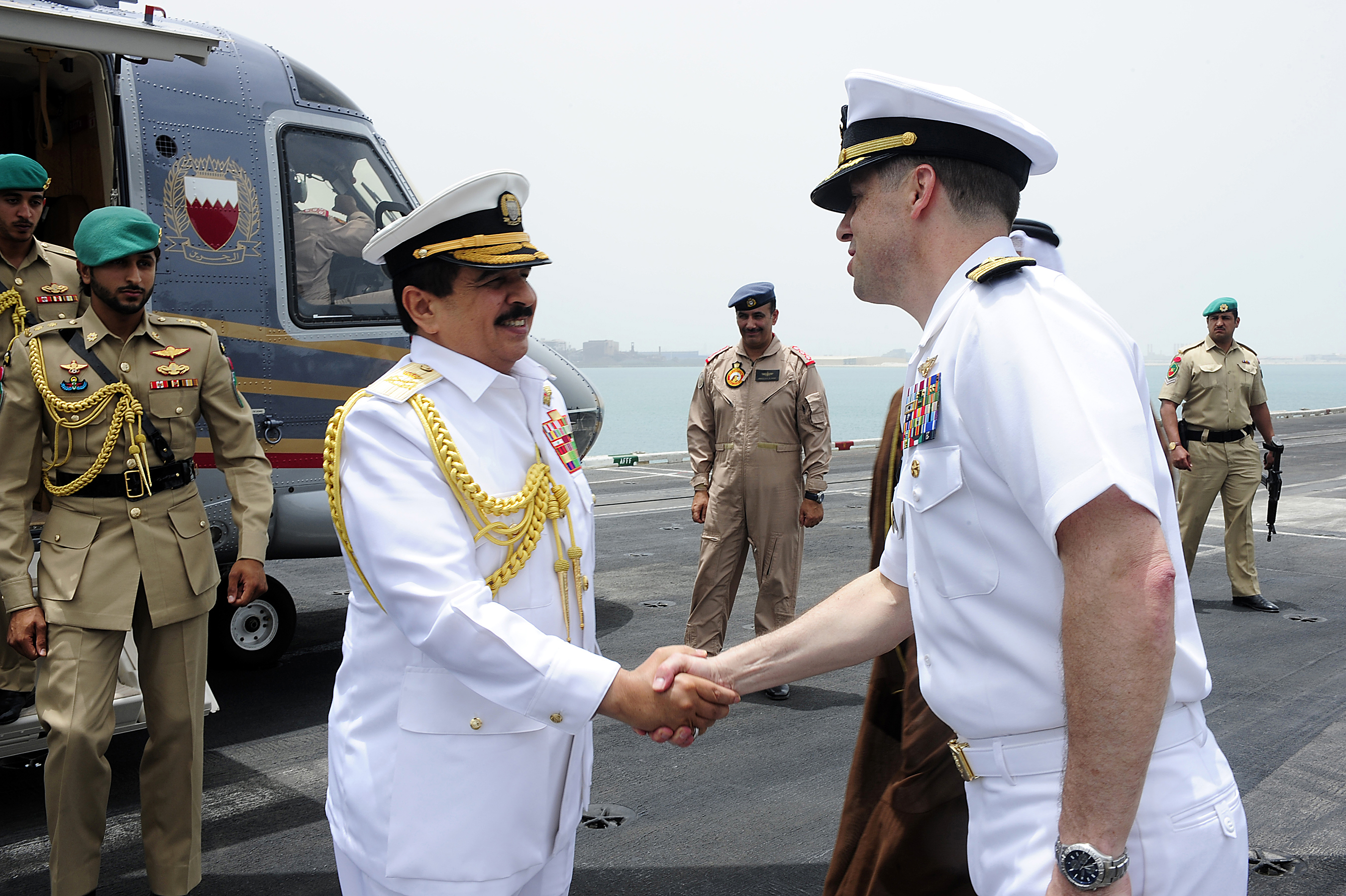 Navy Capt. Ted R. Williams, executive officer, welcomes King Hamad bin Isa Al Khalifa of Bahrain ...