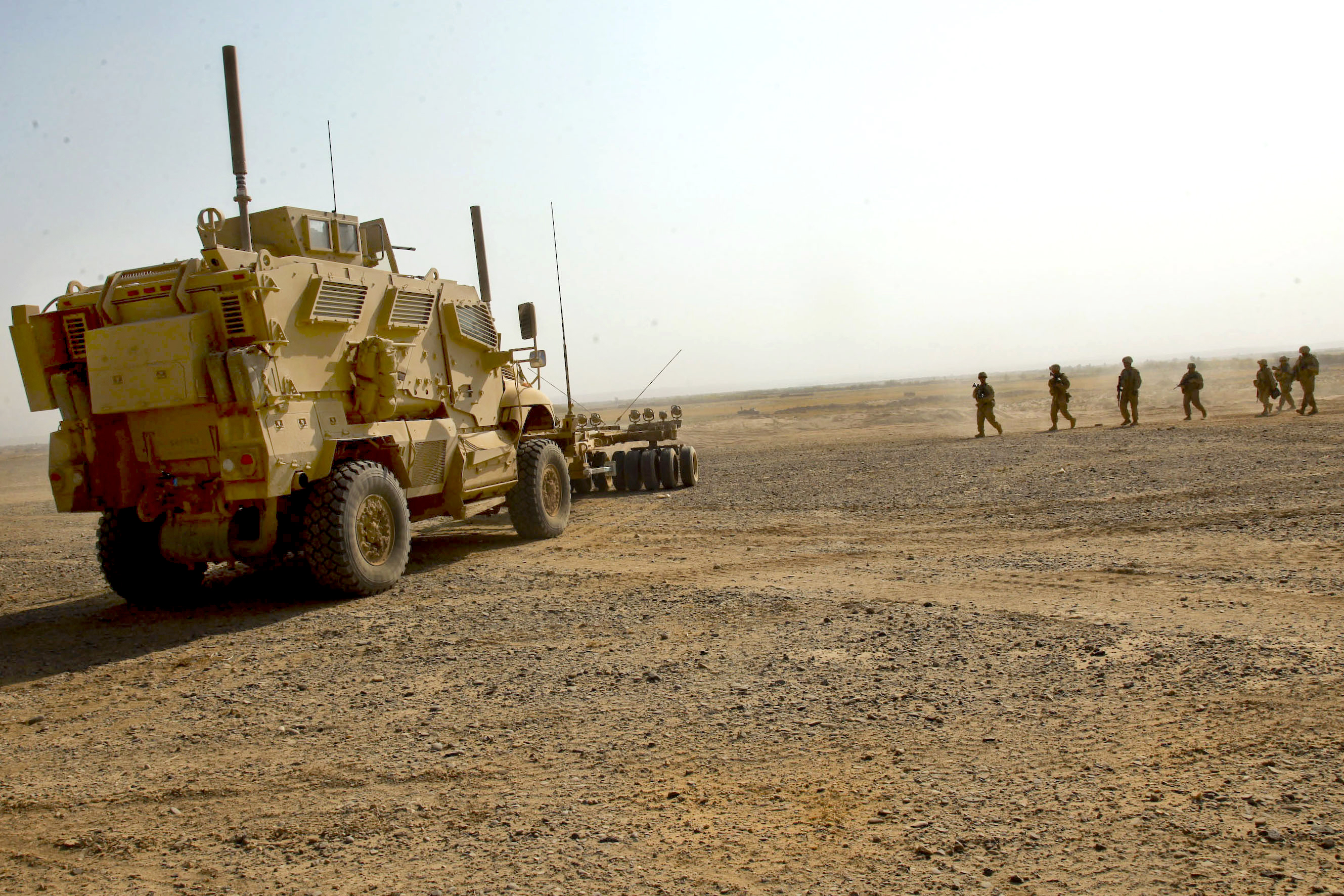 U.S. Marines survey an area for future construction projects in the ...