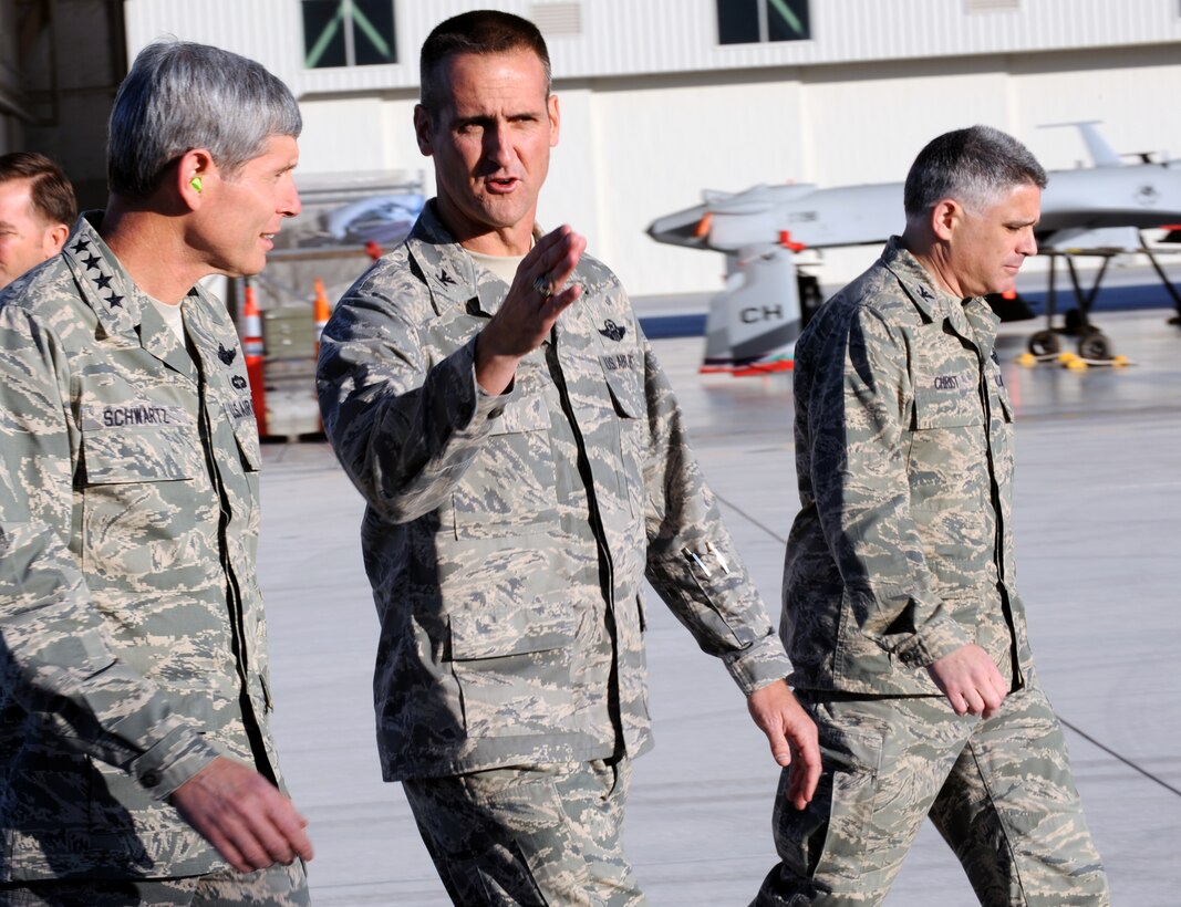 Air Force Chief of Staff Gen. Norton A. Schwartz, left, walks with Air ...