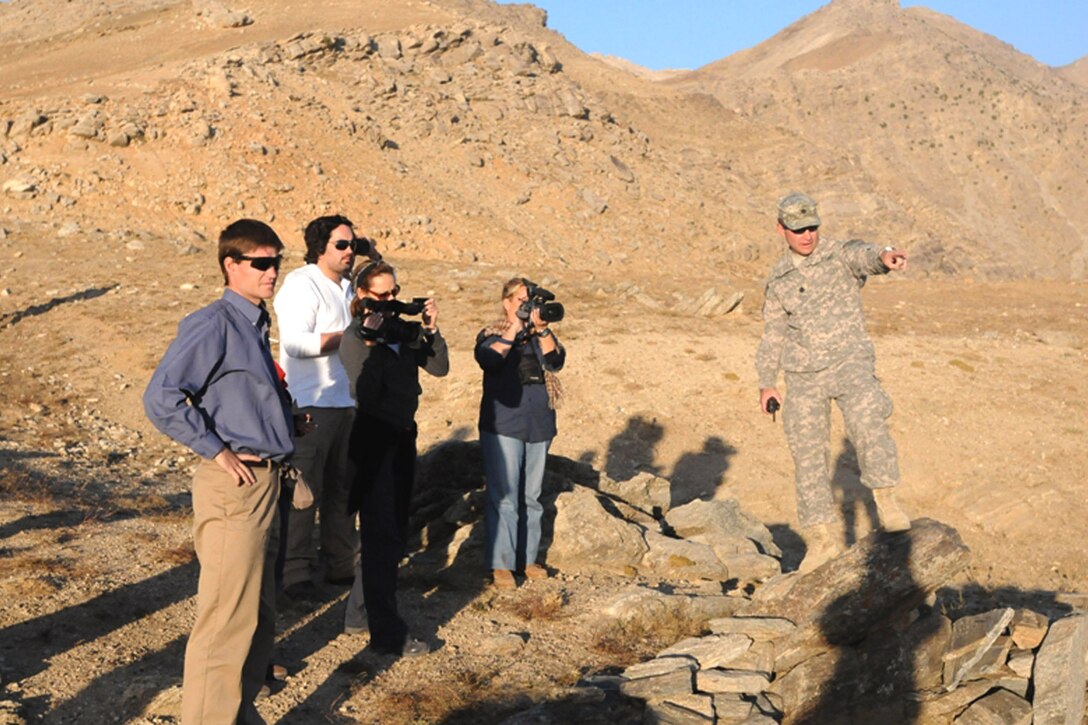 Air Force Lt. Col. Eric W. Hommel, right, commander of the provincial ...