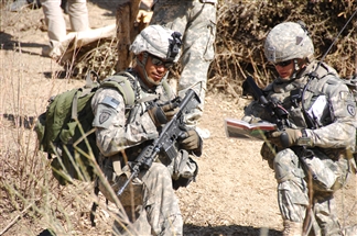 Staff Sgt. Christopher Burger and 2nd Lt. Robert Griffith discuss the ...