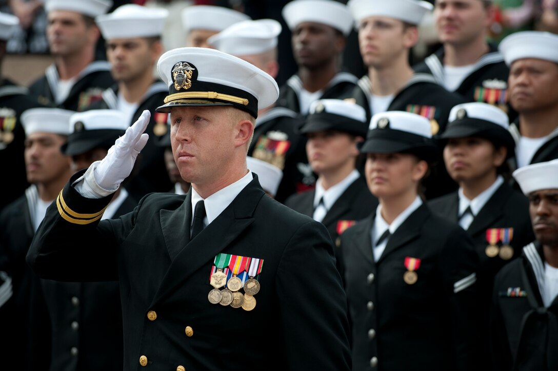 Crew members of the U.S. Navy's newest Arleigh Burke-class guided ...