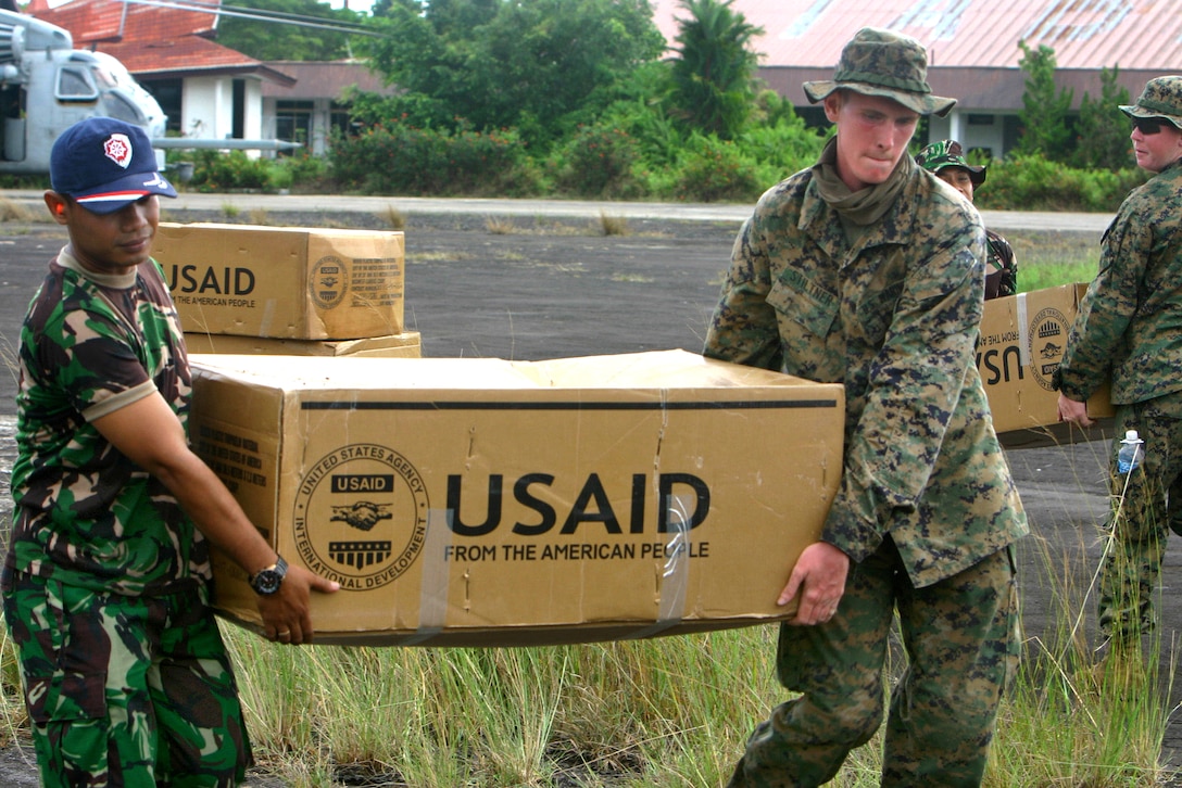 U.S. Marine Corps Lance Cpl. Matthew Stiltner, right, and an Indonesian ...